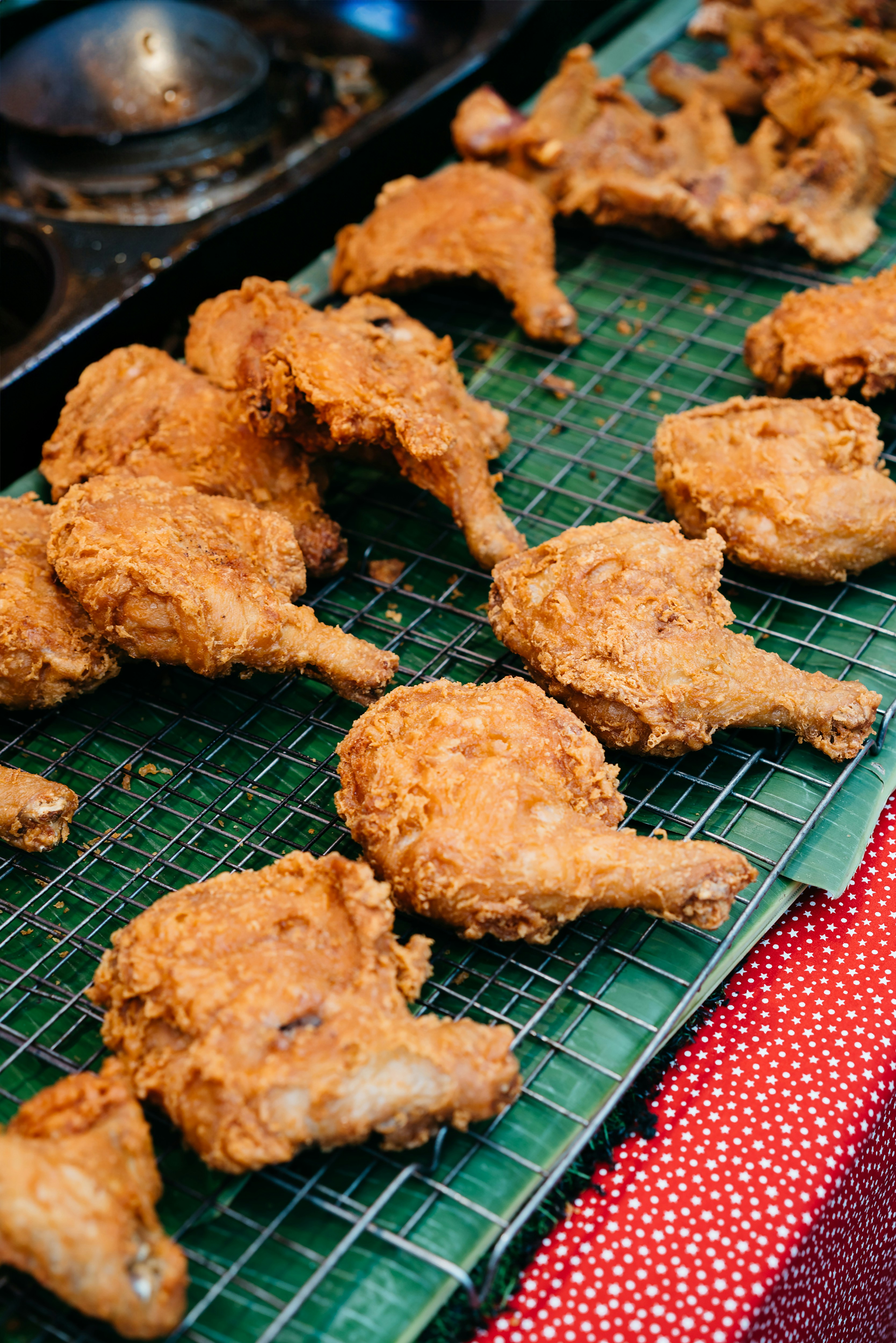 A bunch of fried chicken on a cooling rack photo – Free Bangkok Image ...