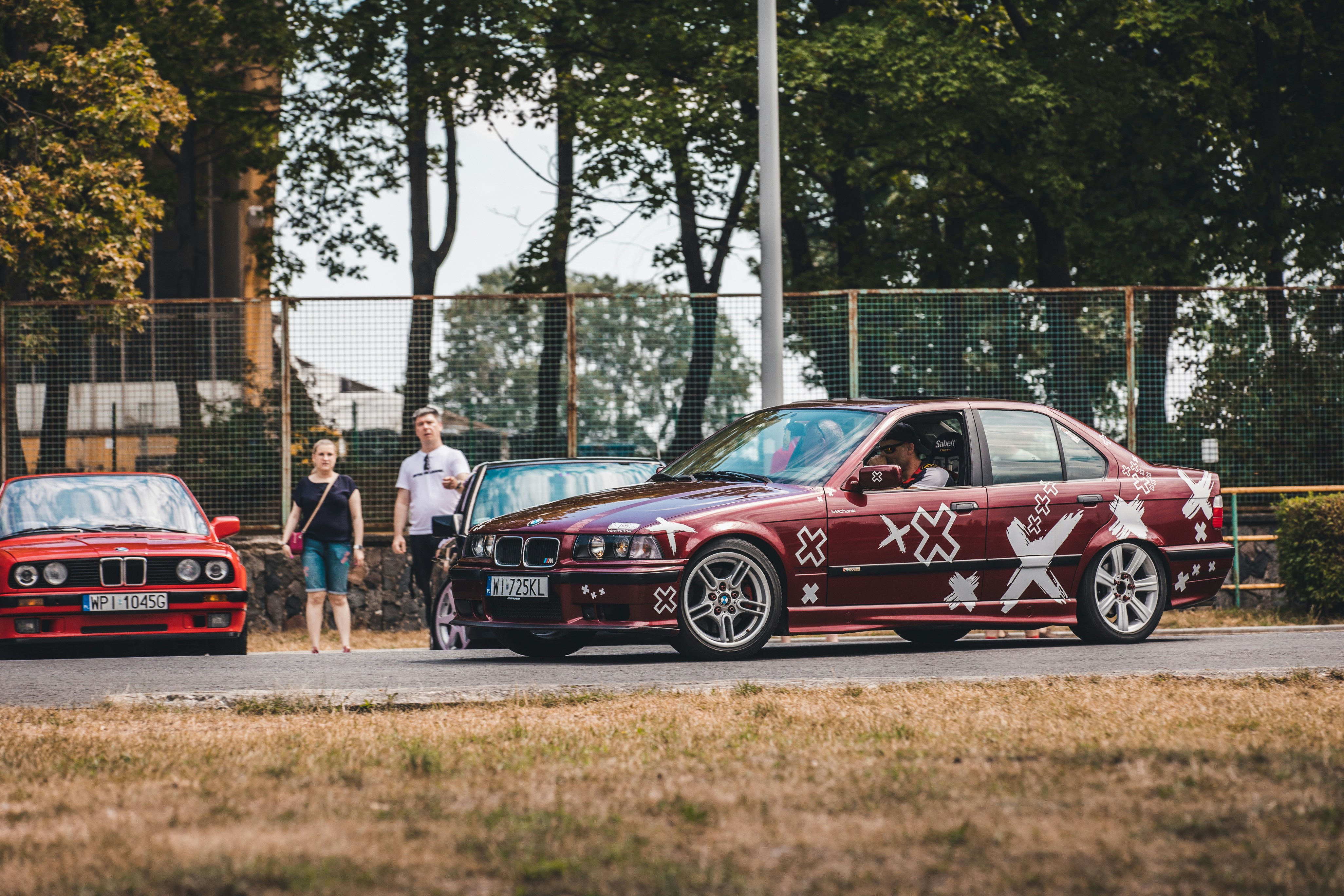 A Row of Decals and Wheels: A Car Meet Snapshot