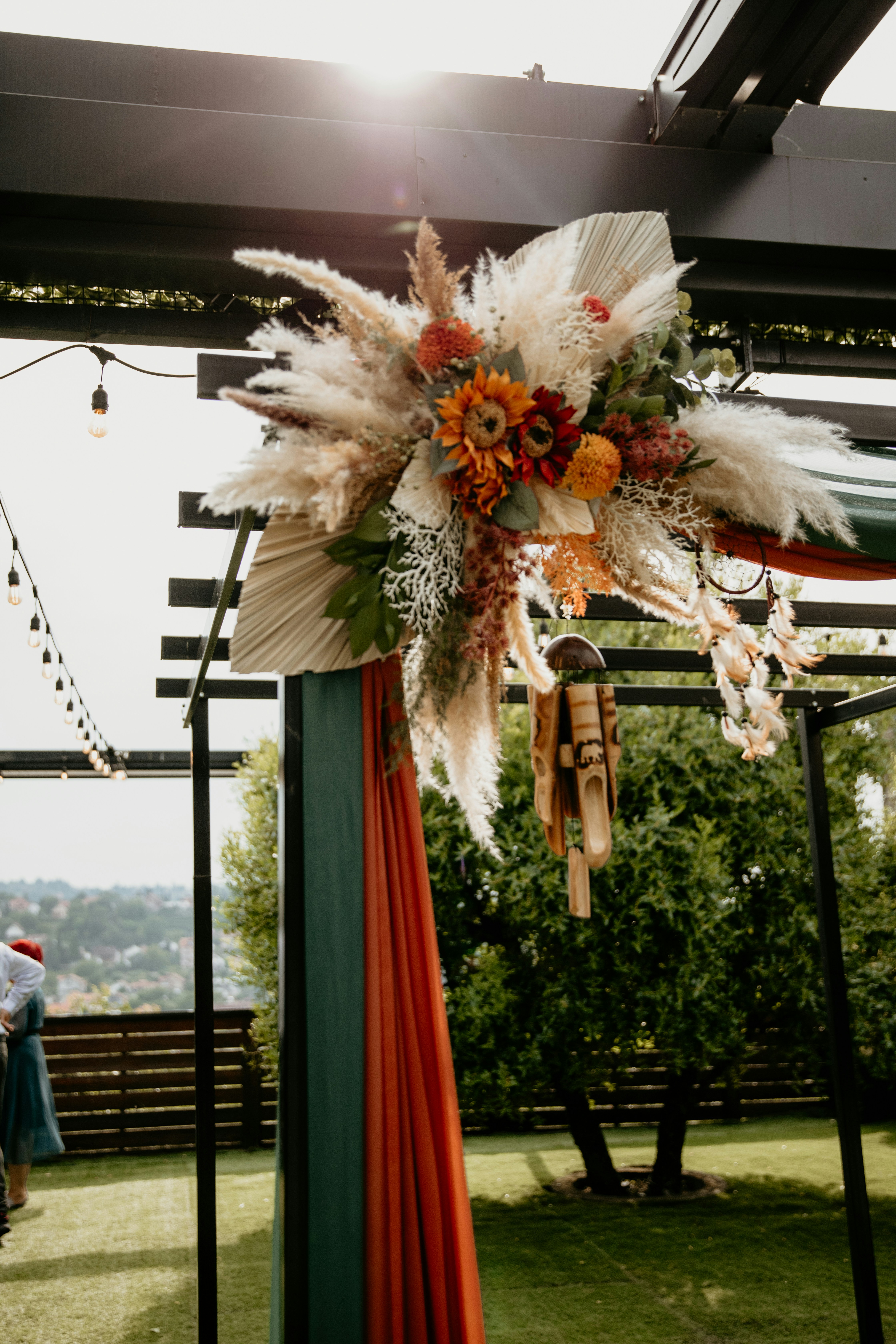 A wedding arch decorated with flowers and feathers photo – Free Flower ...