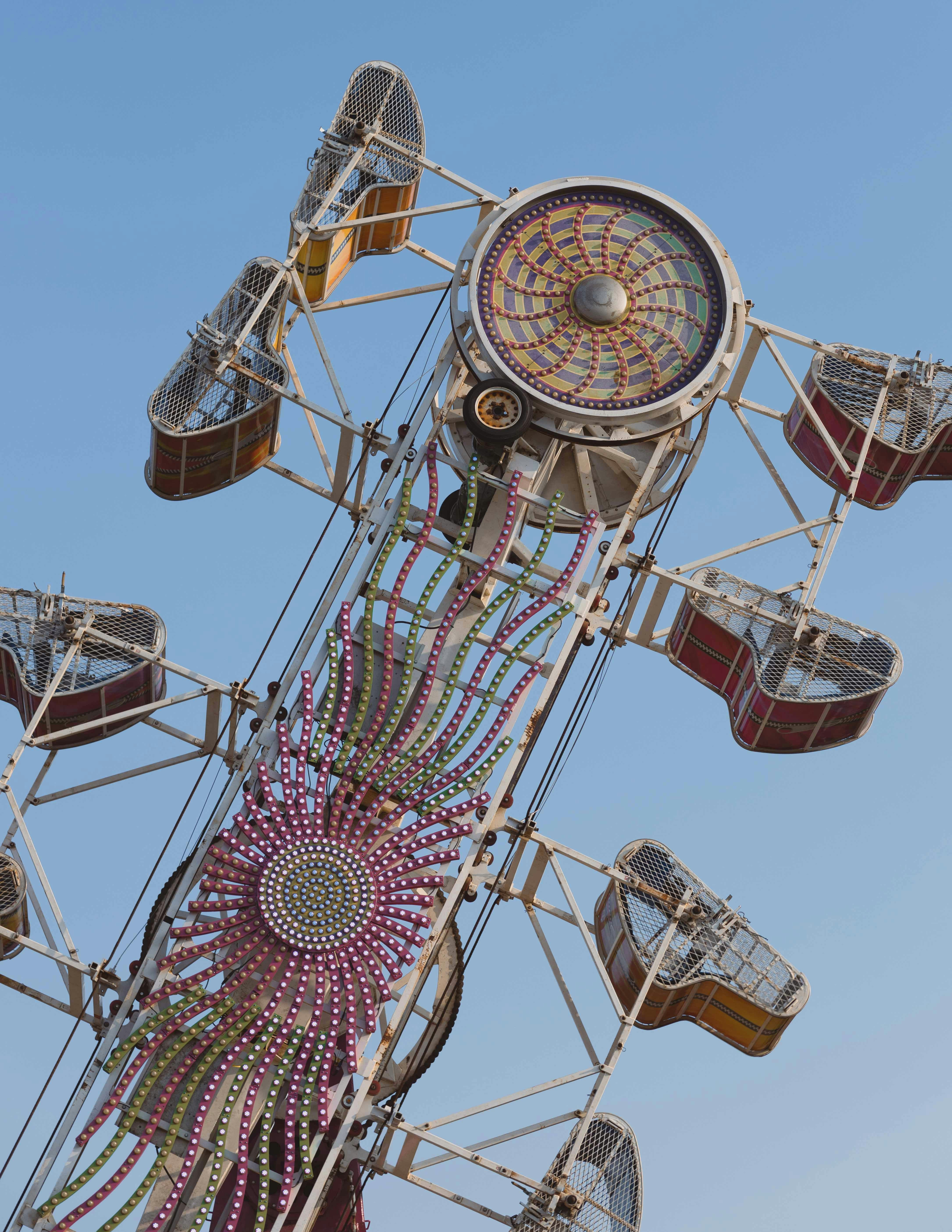 A ferris wheel with a clock on top of it photo – Free Ferris wheel ...