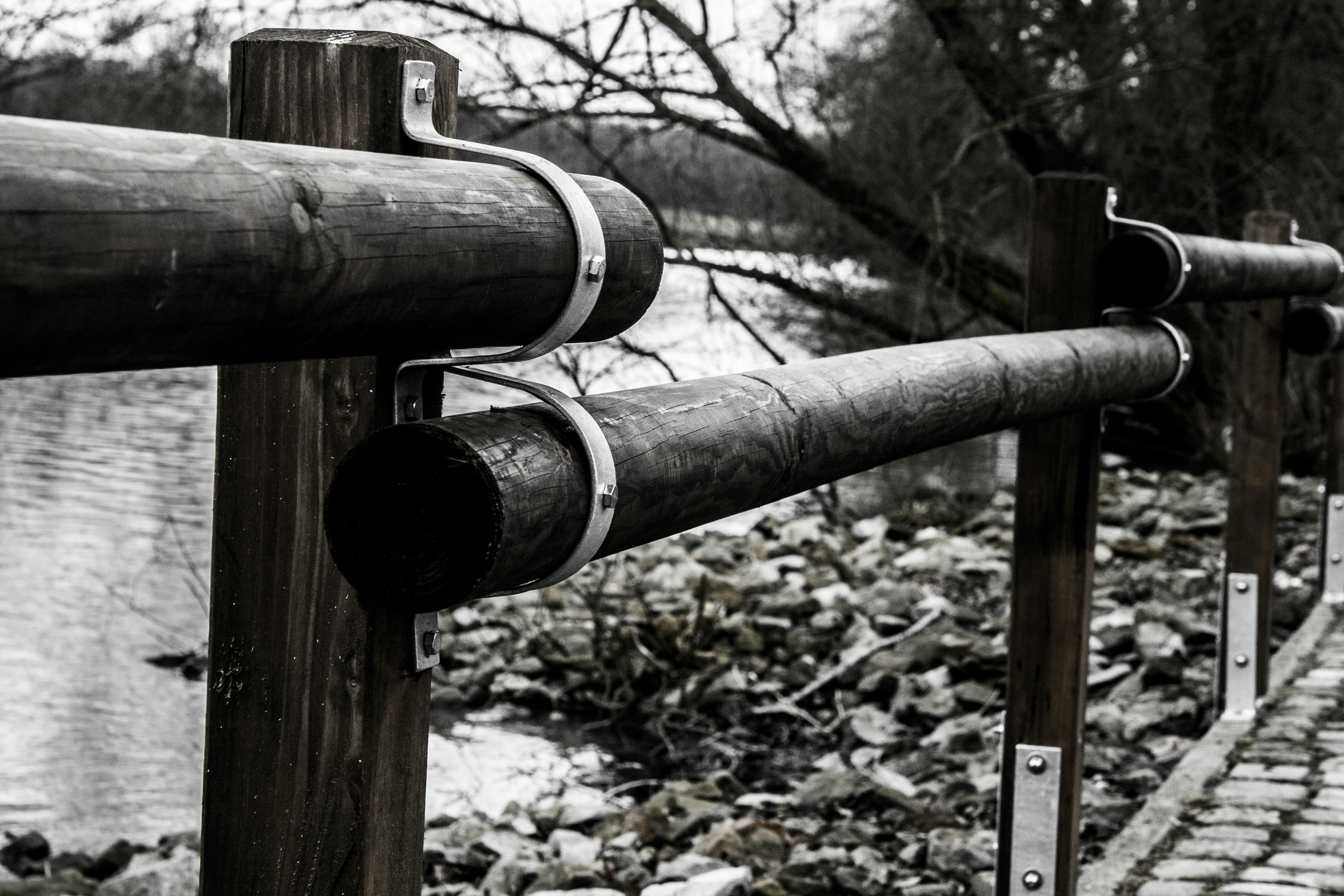 Monochrome Rails Lead the Eye Along a Quiet Riverside