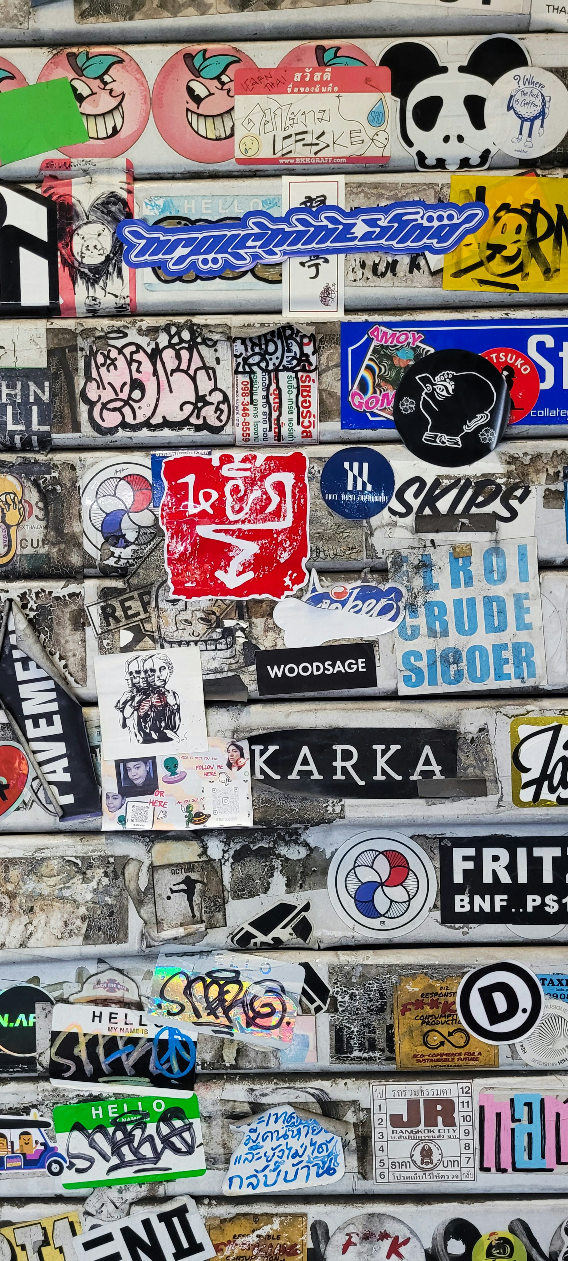 A bunch of stickers are stacked on top of each other photo – Free ...