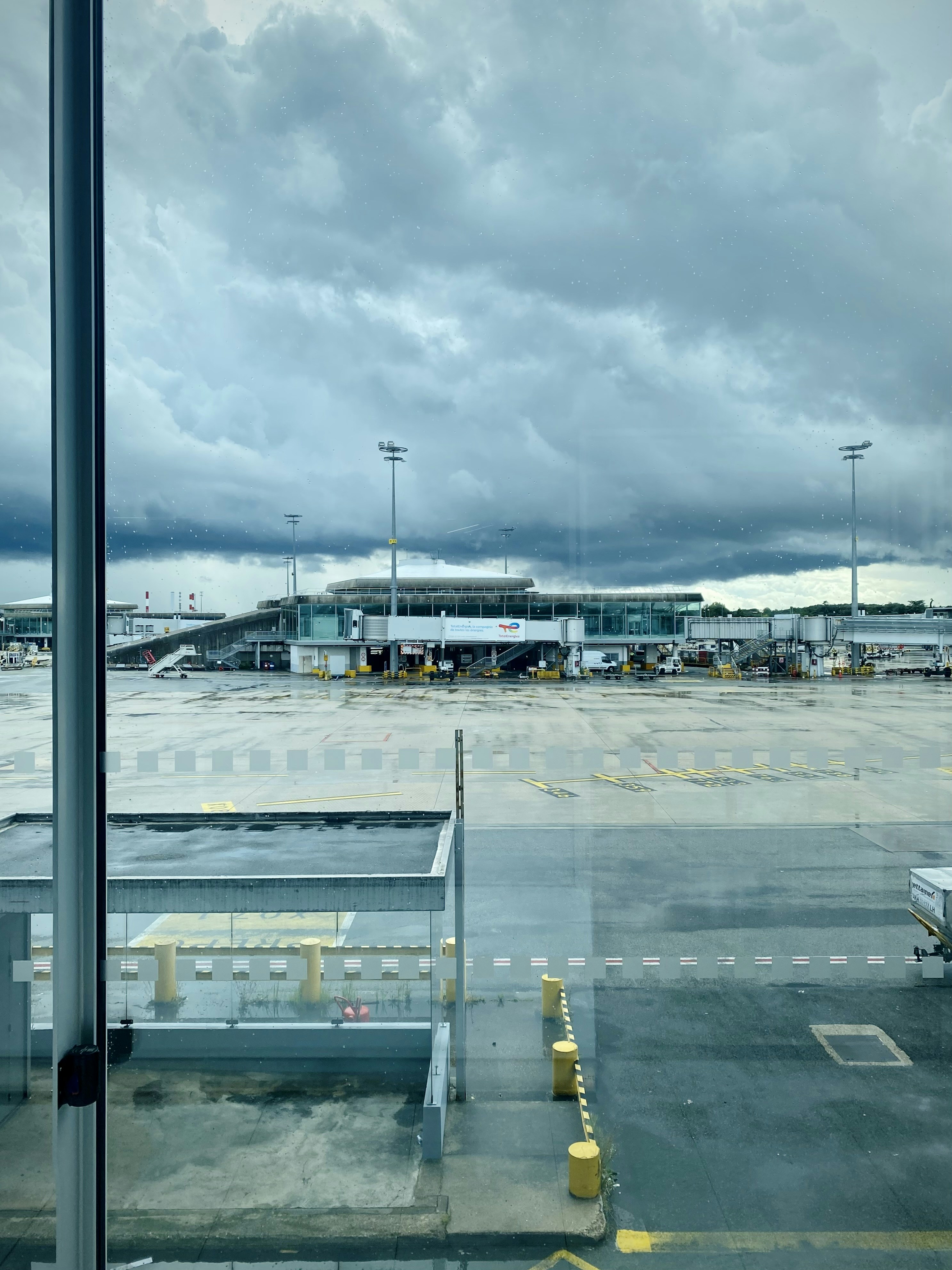 A view of an airport through a window photo – Free France Image on Unsplash