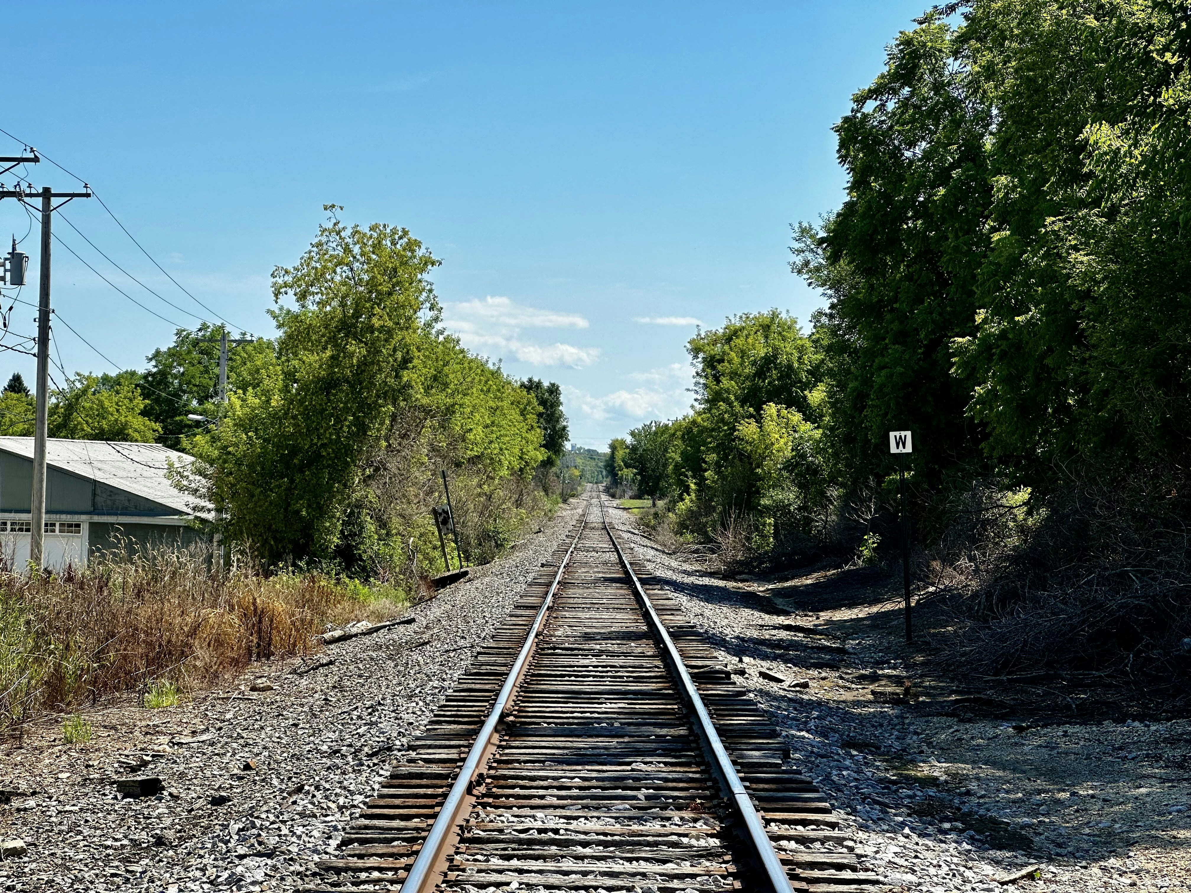A train track running through a wooded area photo – Free Infrastructure ...