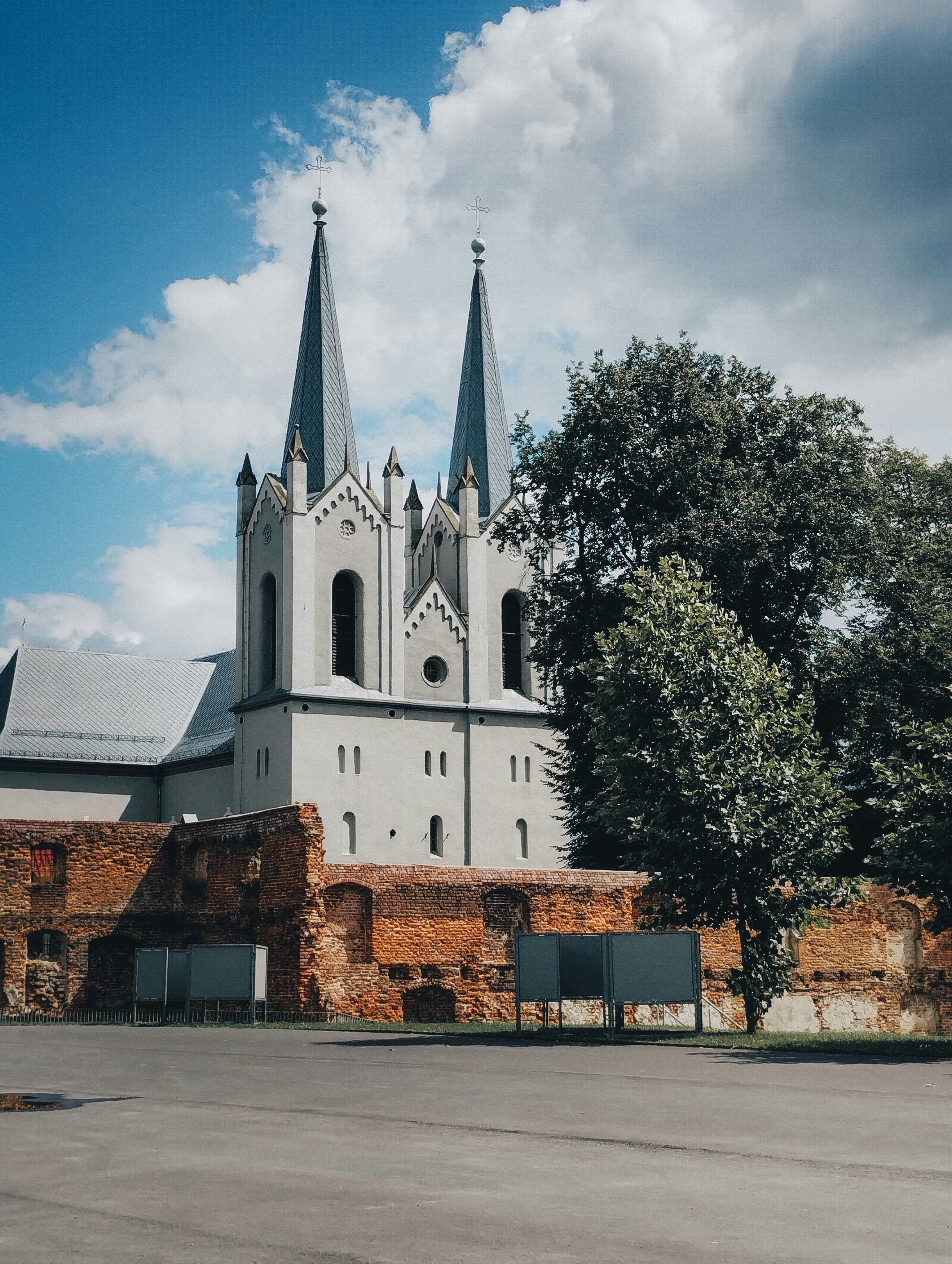 Twin Spires Above the Weathered Brick: A Quiet Cathedral Scene
