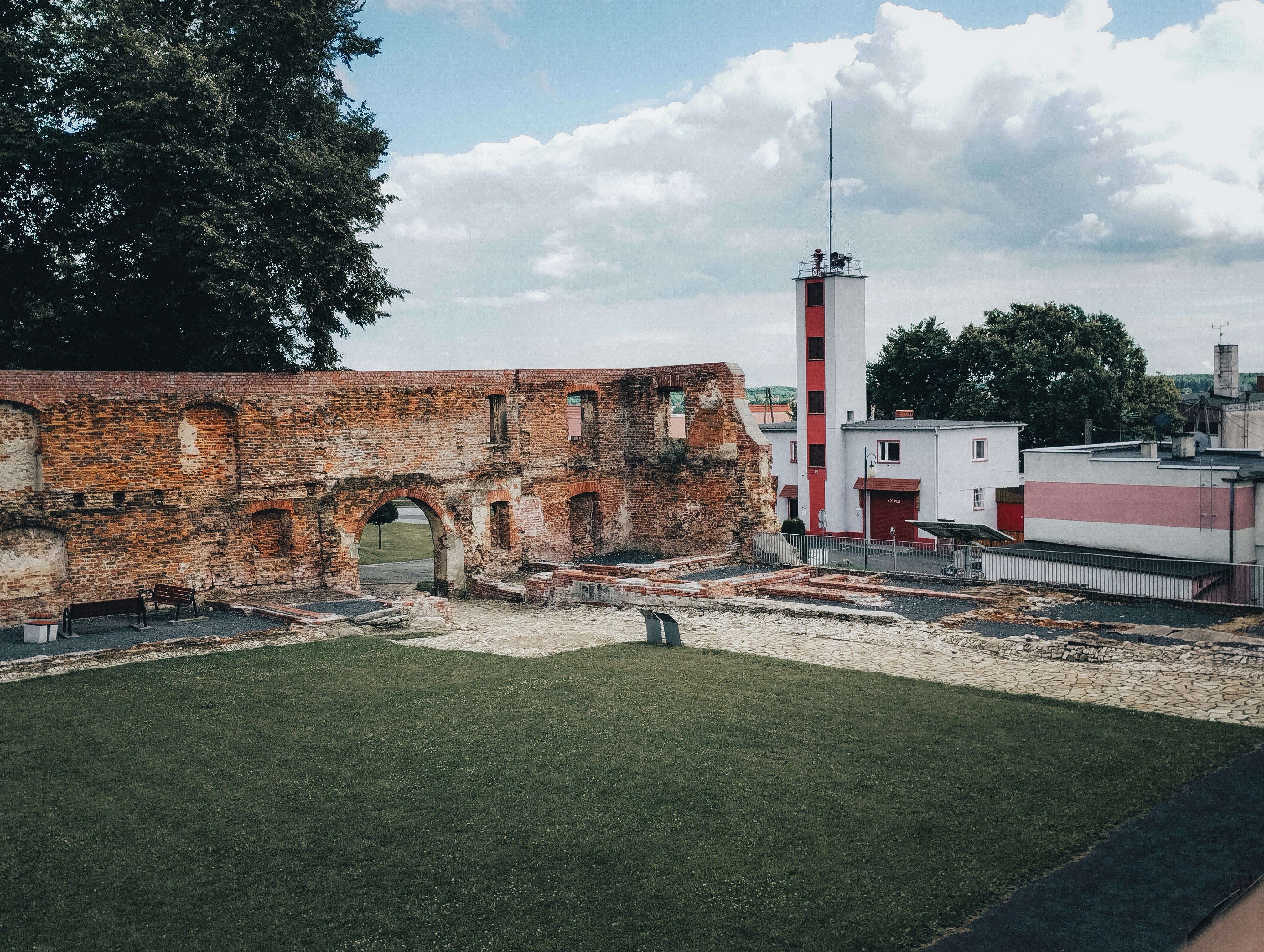 Ruins and Red-White Lighthouse: A Quiet Riverfront Terrace