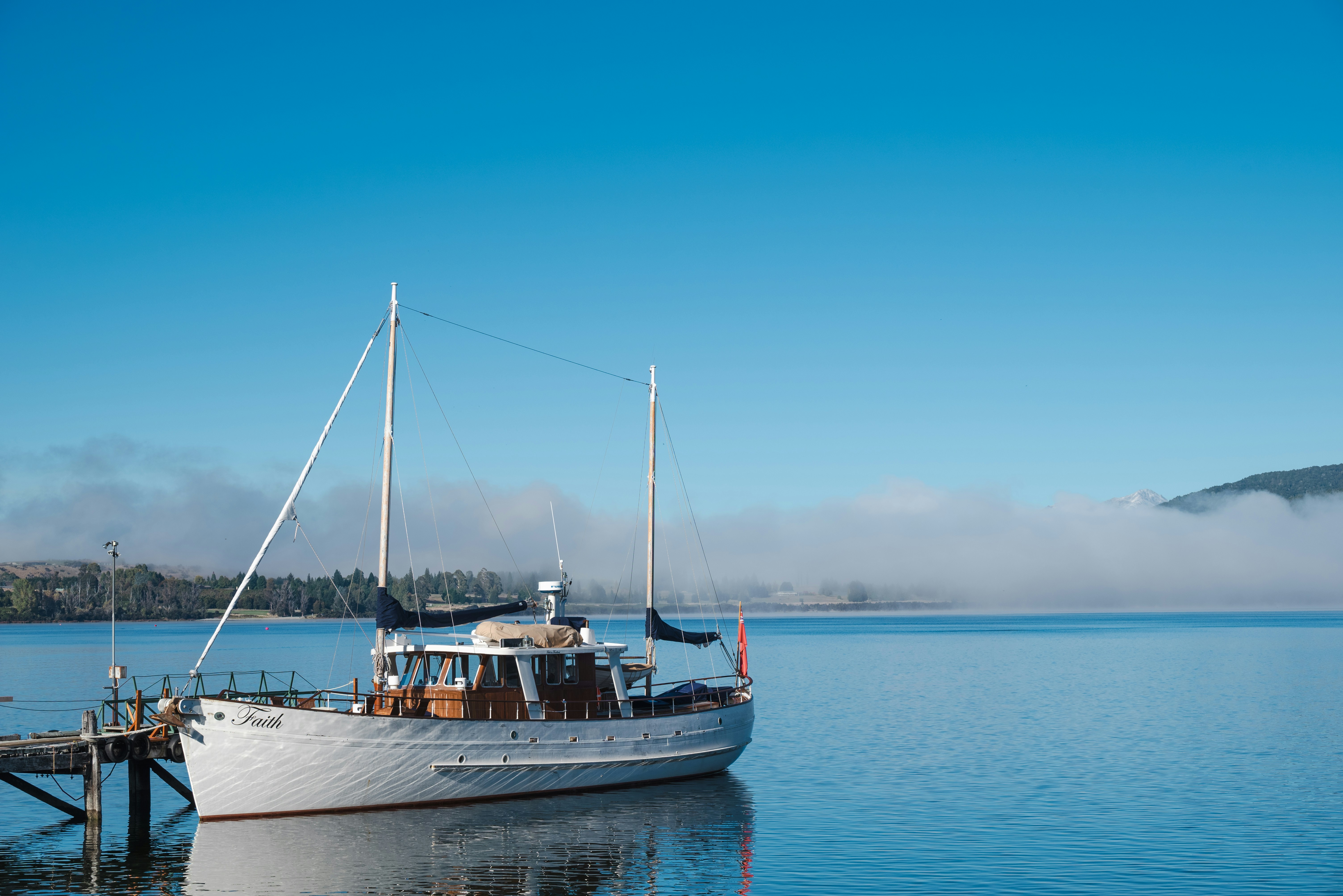 Blue Silence over the Harbor: A Docked Schooner in Quiet Light