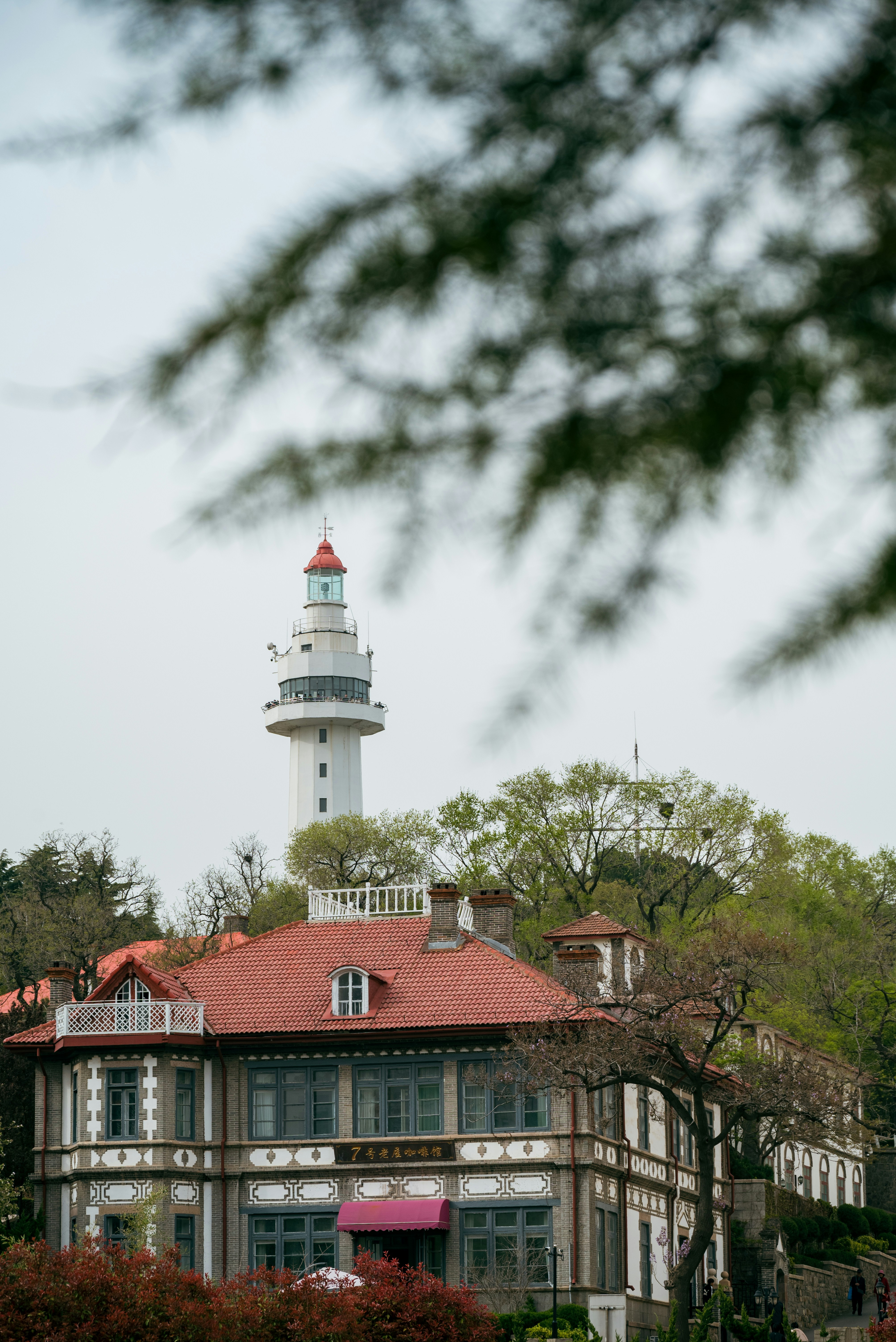 A building with a light house on top of it photo – Free Yantai Image on ...