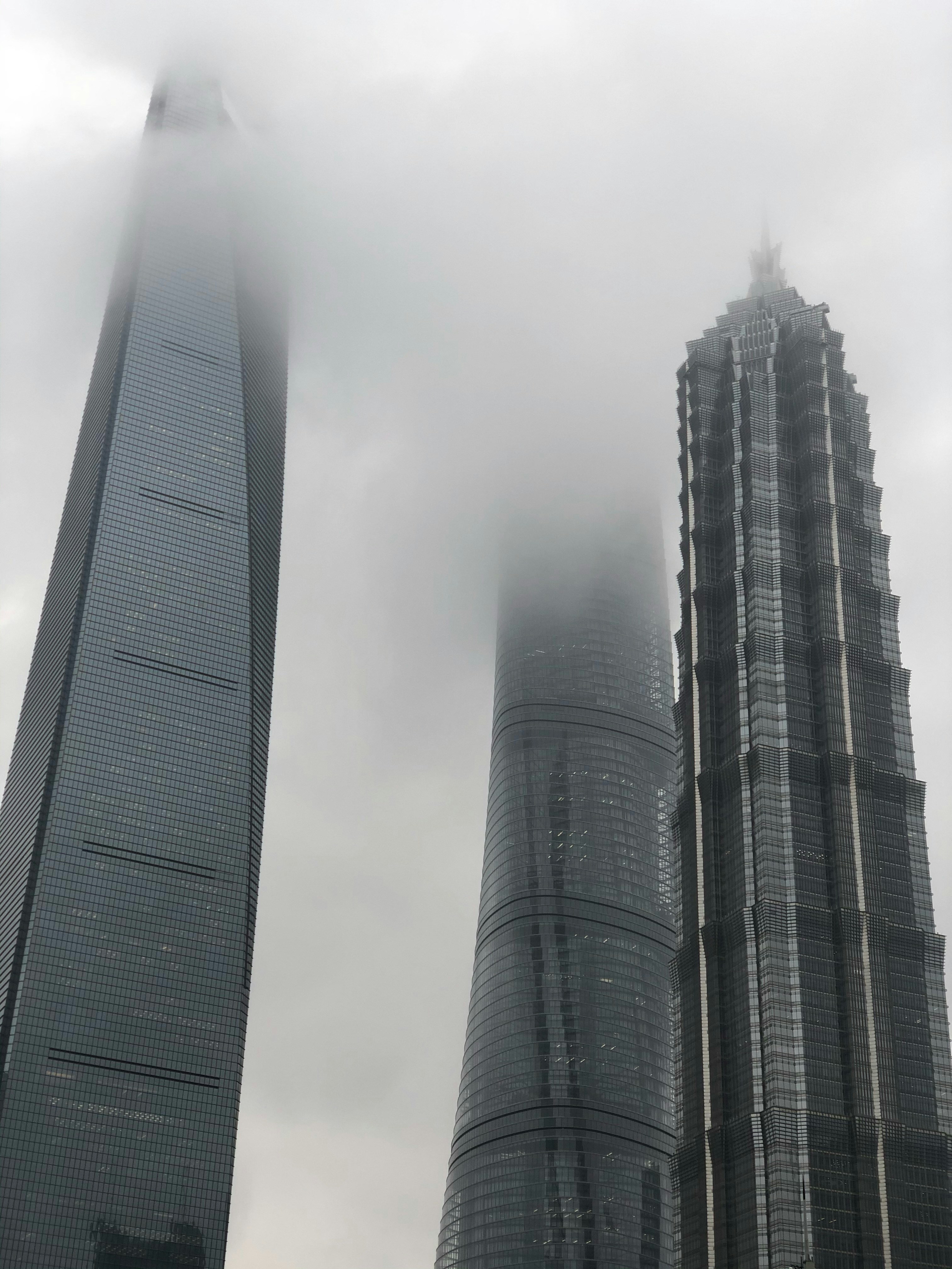 A very tall building with some very tall buildings in the background ...