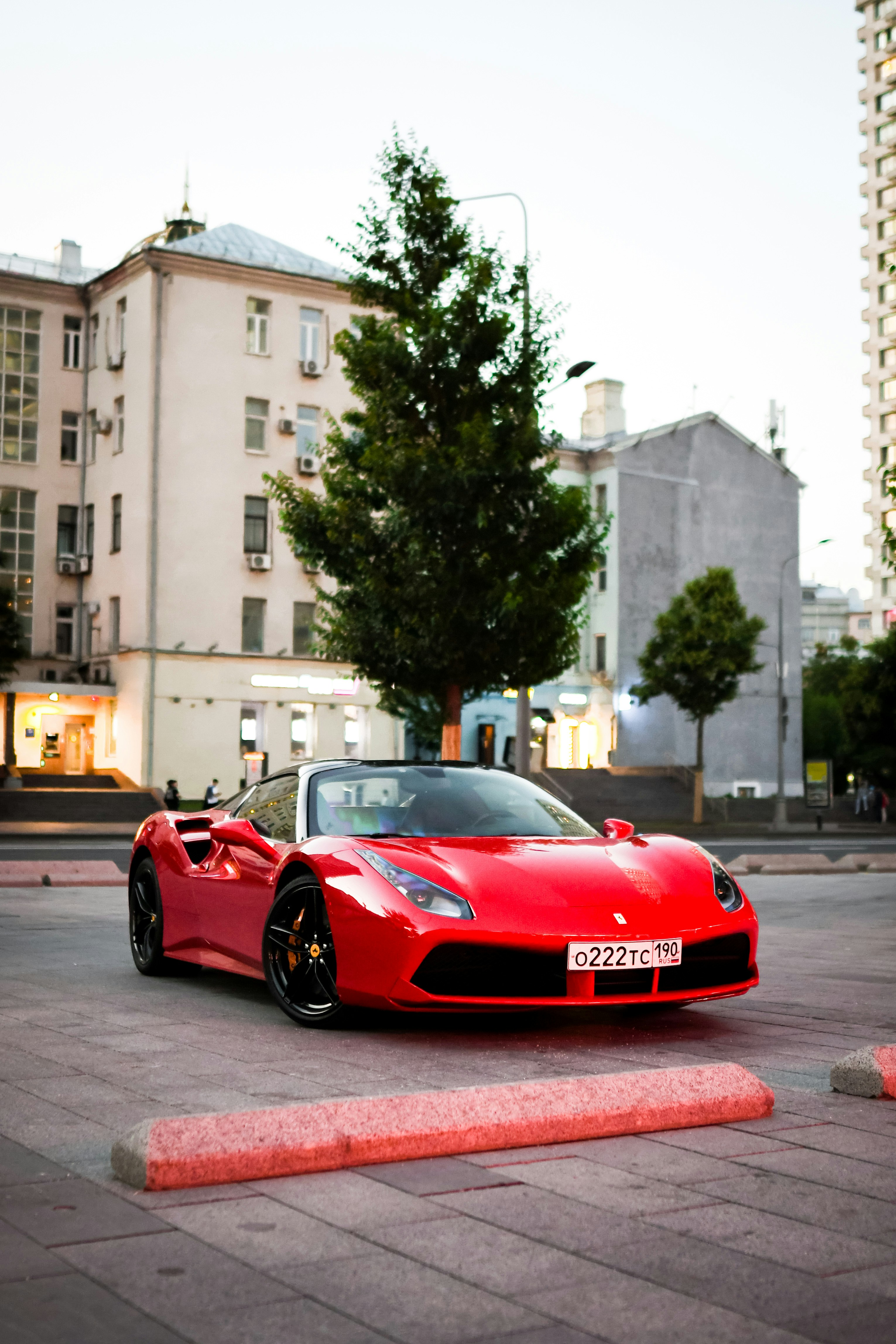Vibrant Red Elegance Against Urban Backdrop