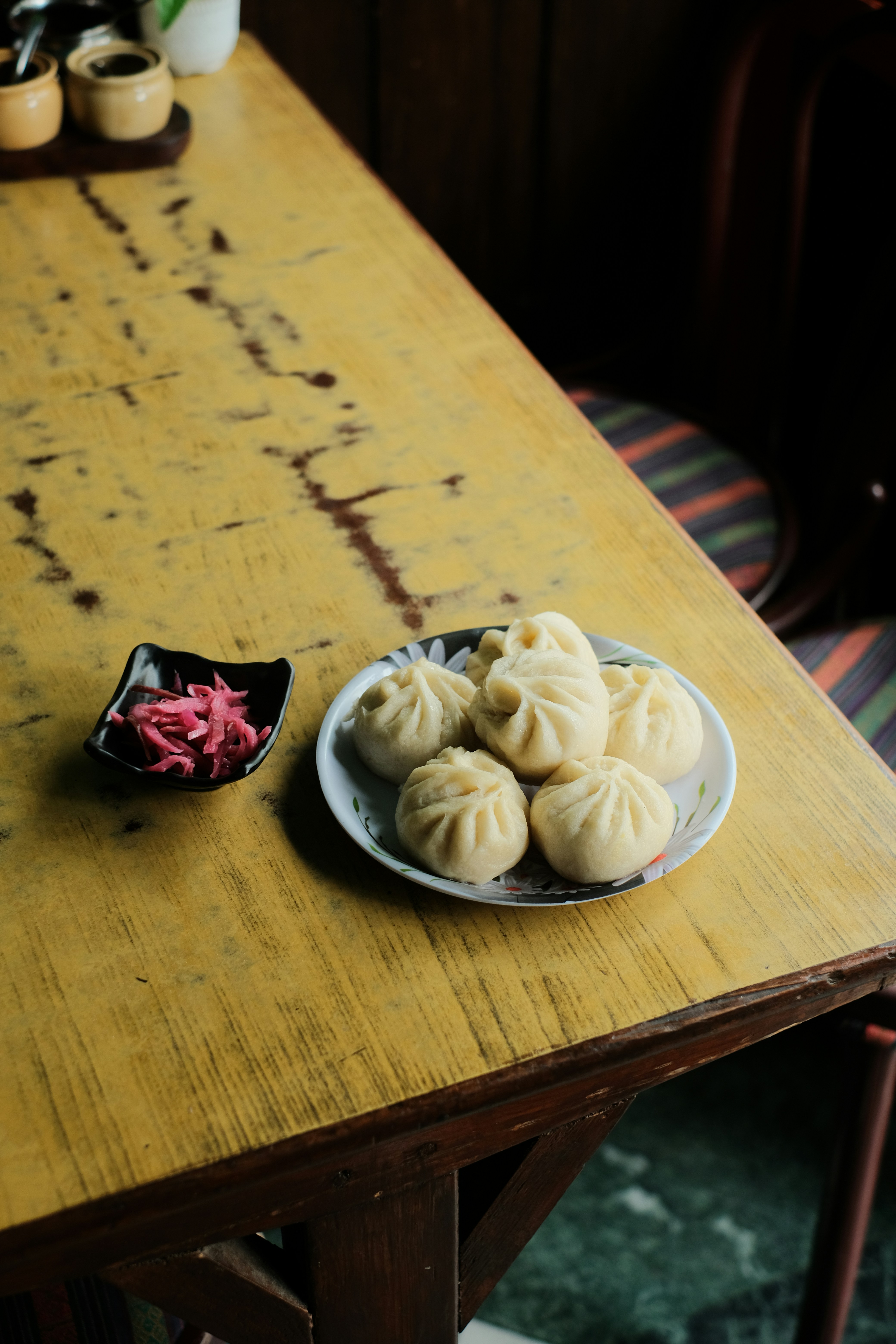 A plate of dumplings on a wooden table photo – Free India Image on Unsplash