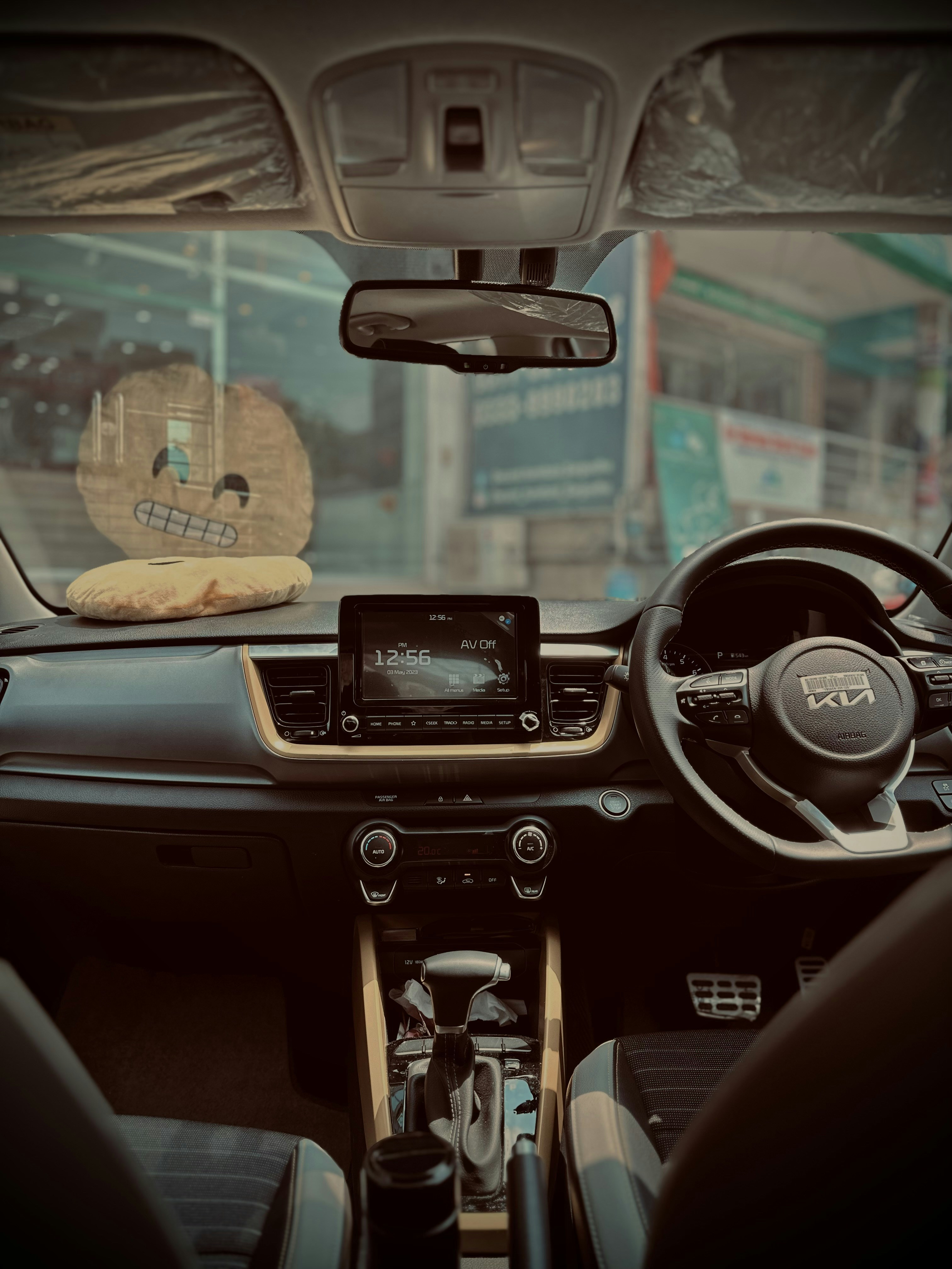 Soft Mascot on the Dash: A Quiet Car Interior Portrait