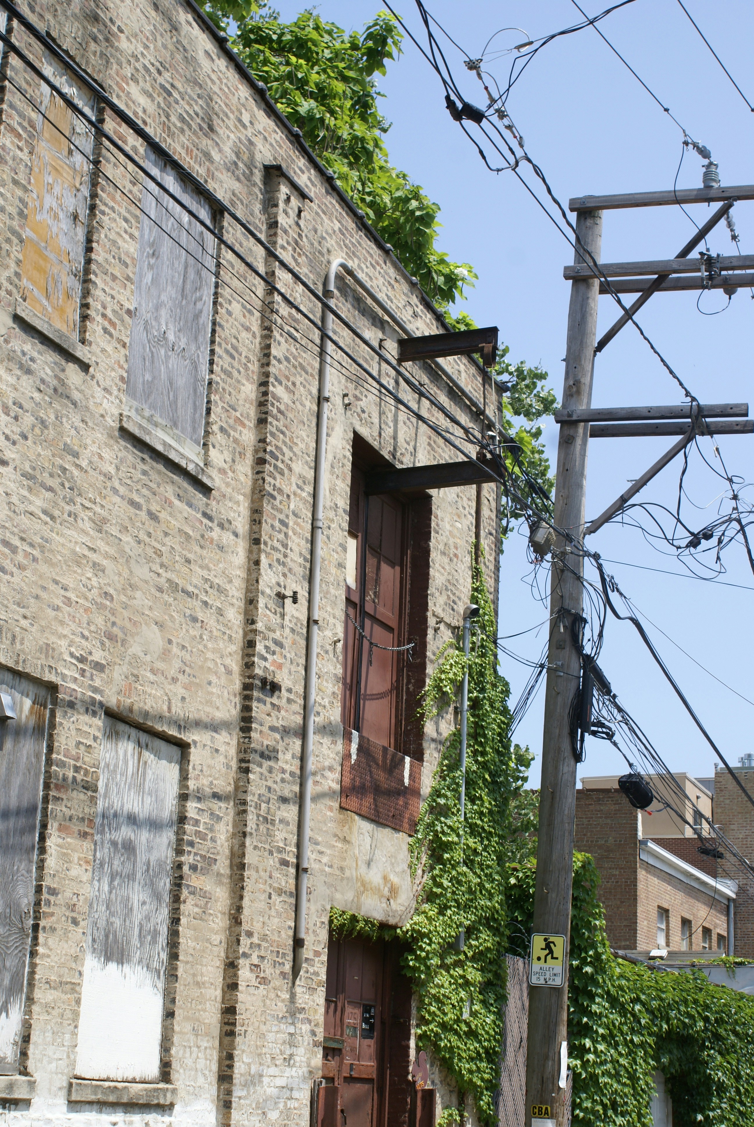 Brick Facade and Ivy Climber by a Transit-Eligible Utility Pole