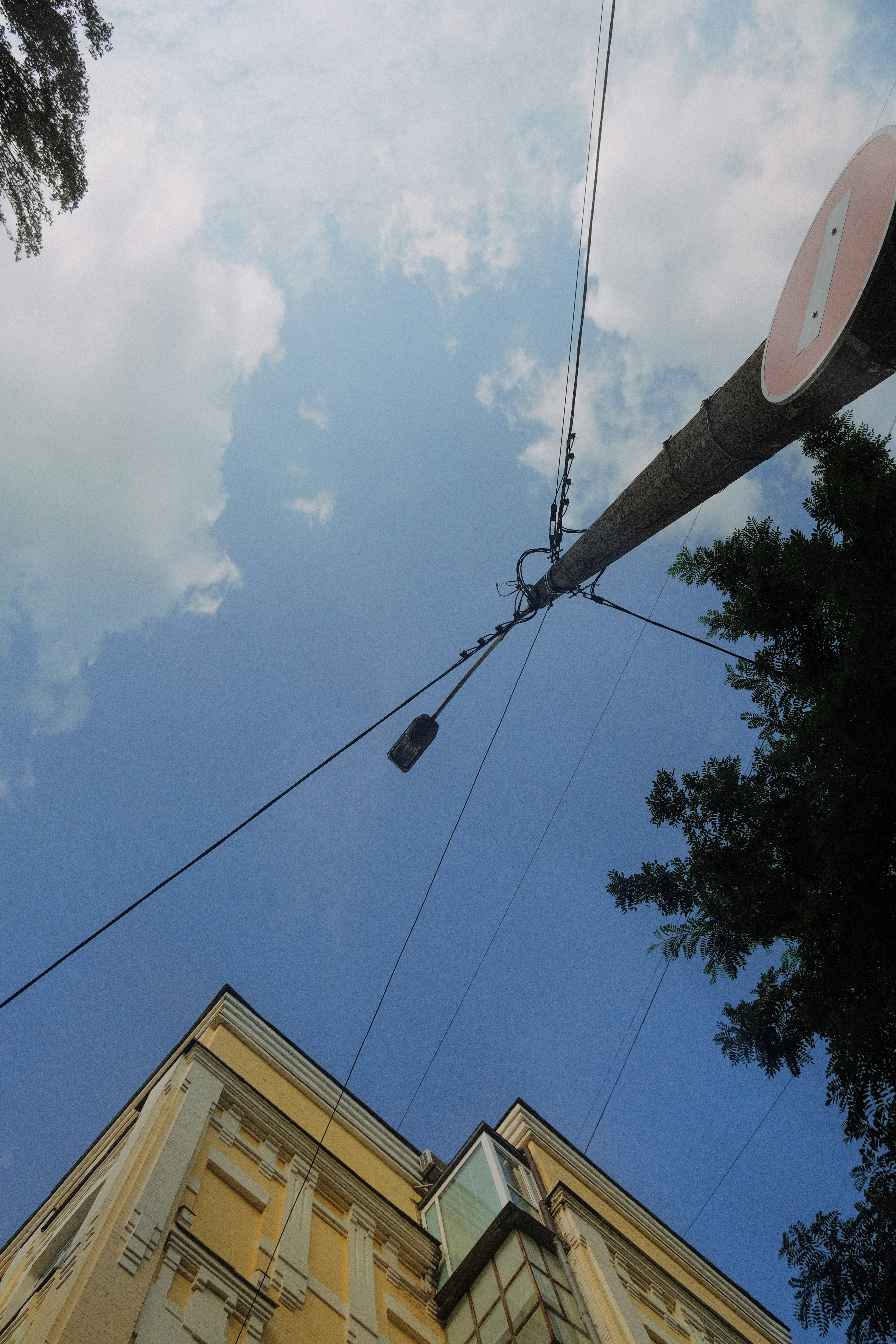 Angle of the Streetlight: A Tilted Skyline Between Buildings