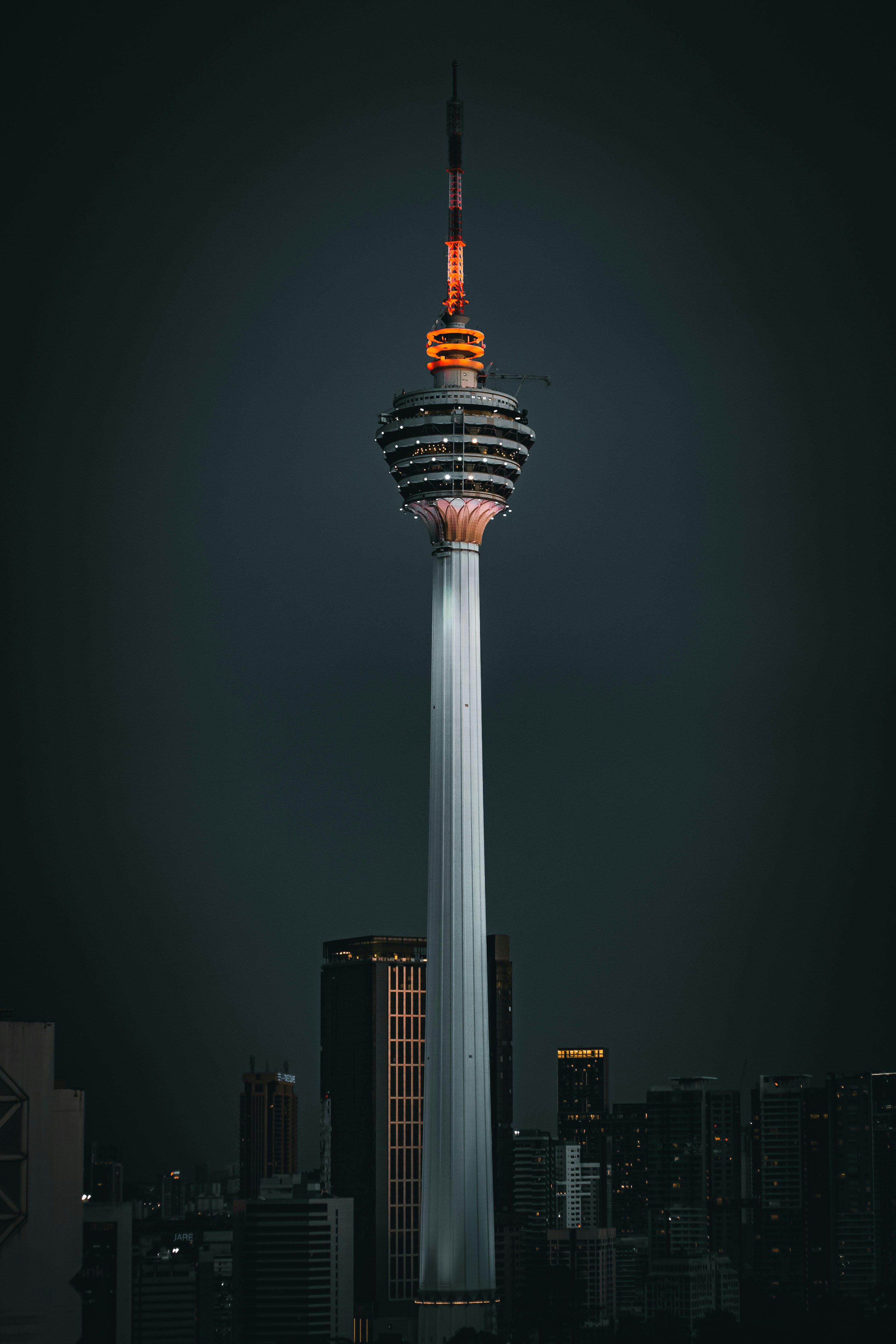 A tall tower with a sky scraper on top of it photo – Free Kuala lumpur ...