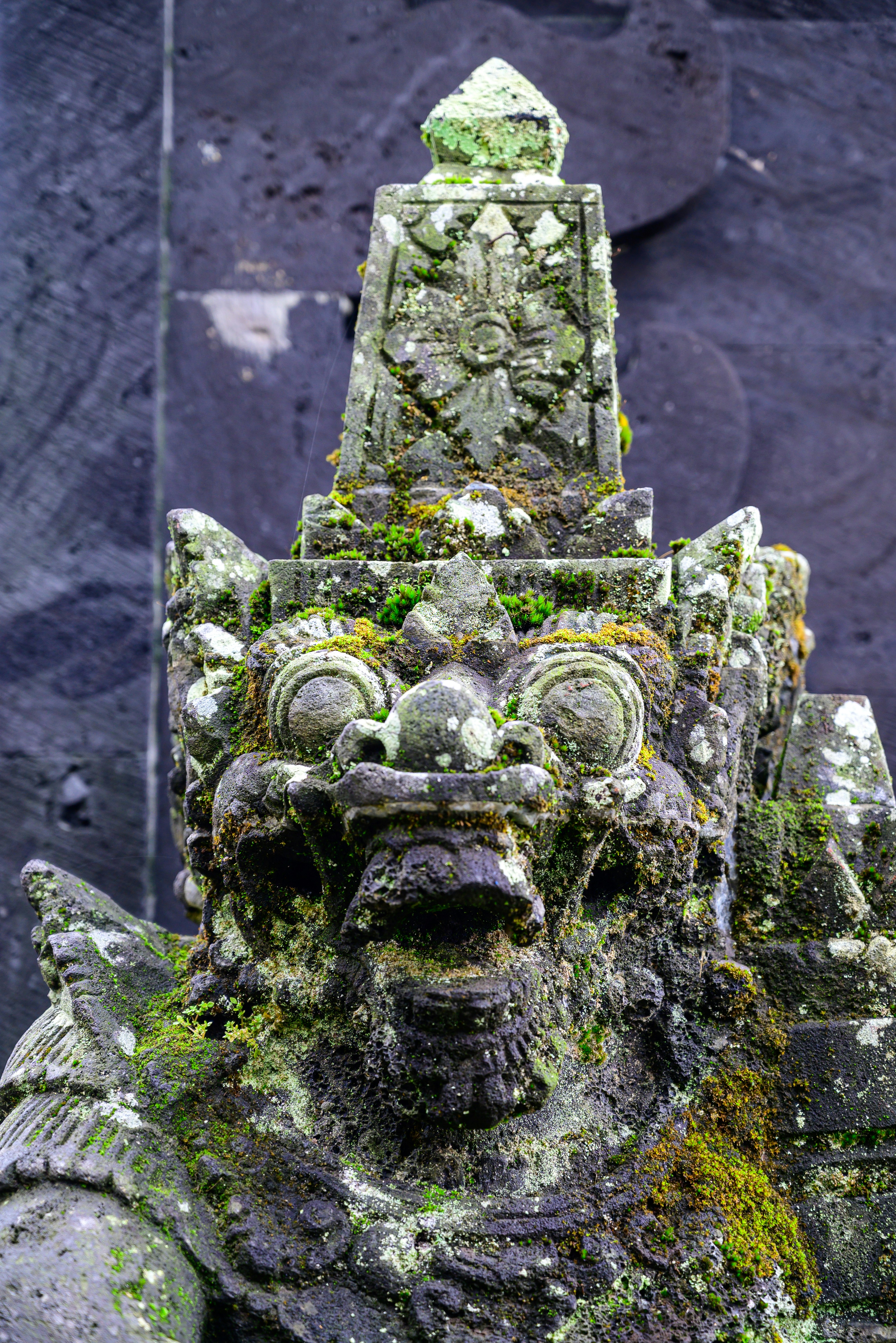 A stone statue with moss growing on it photo – Free Indonesia Image on ...