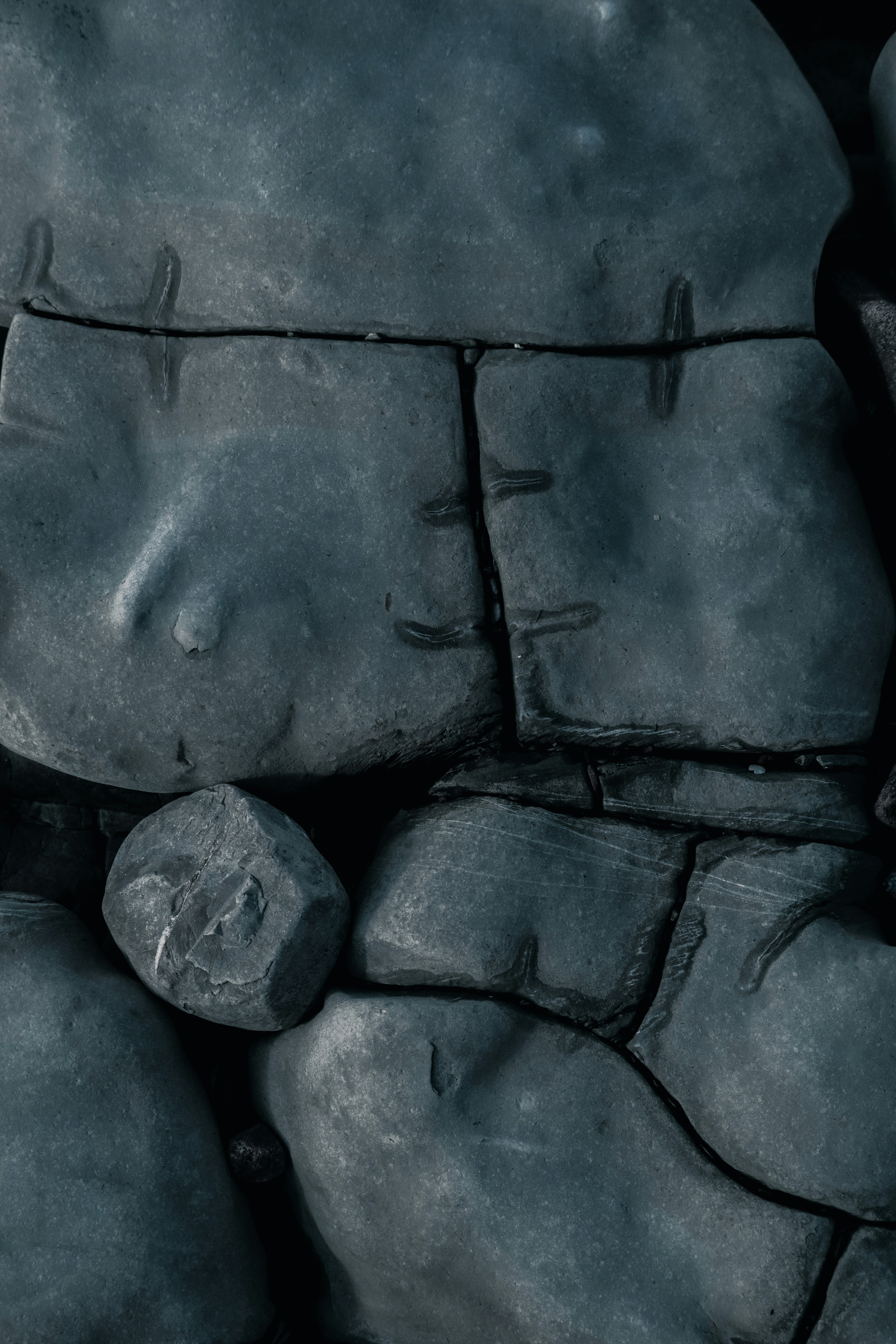 Corded Monolith: A Macro of Bound Stone in Deep Indigo Tones