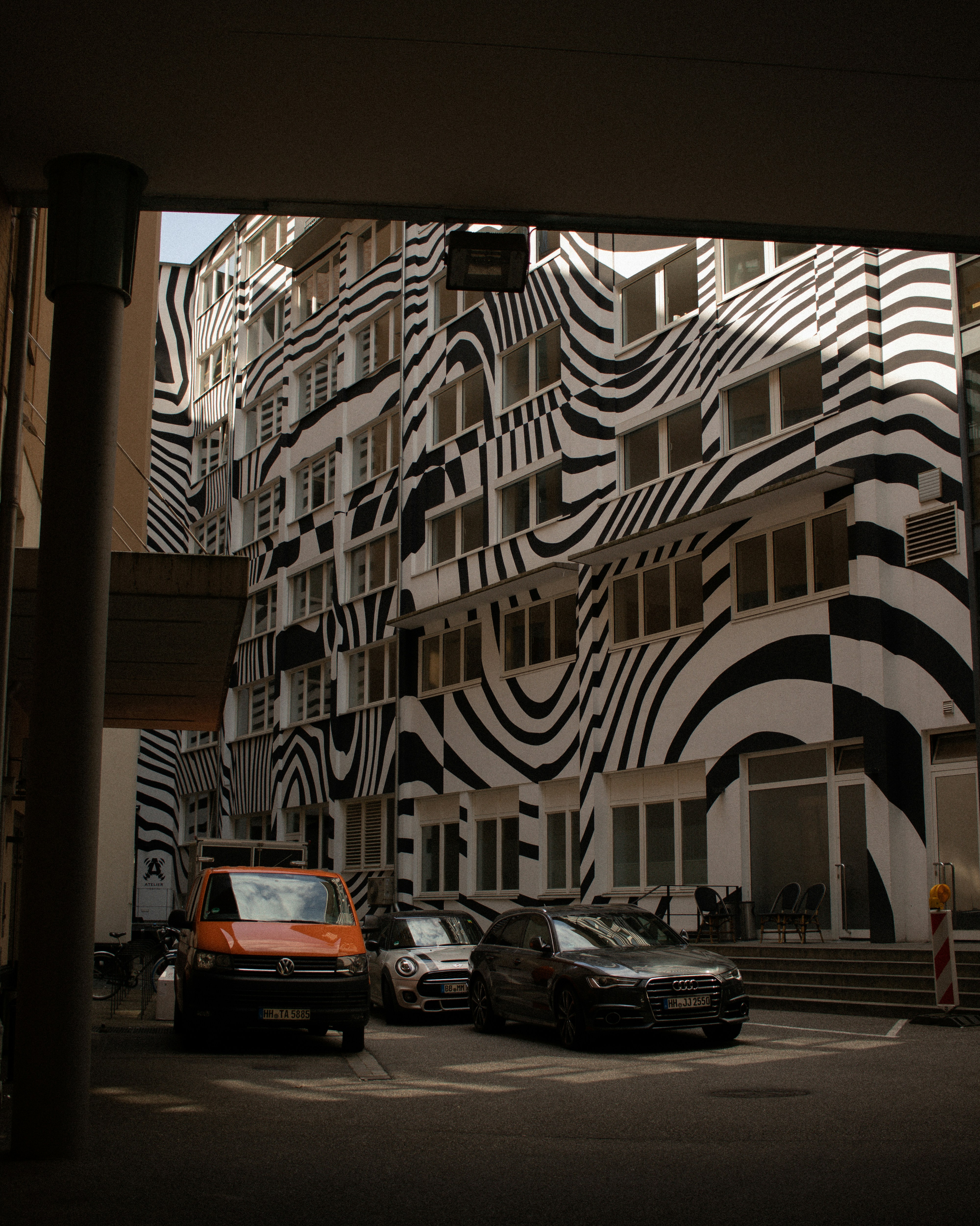 Optical Mirage: The Zebra-Stripe Facade Framing a Quiet City Arrival