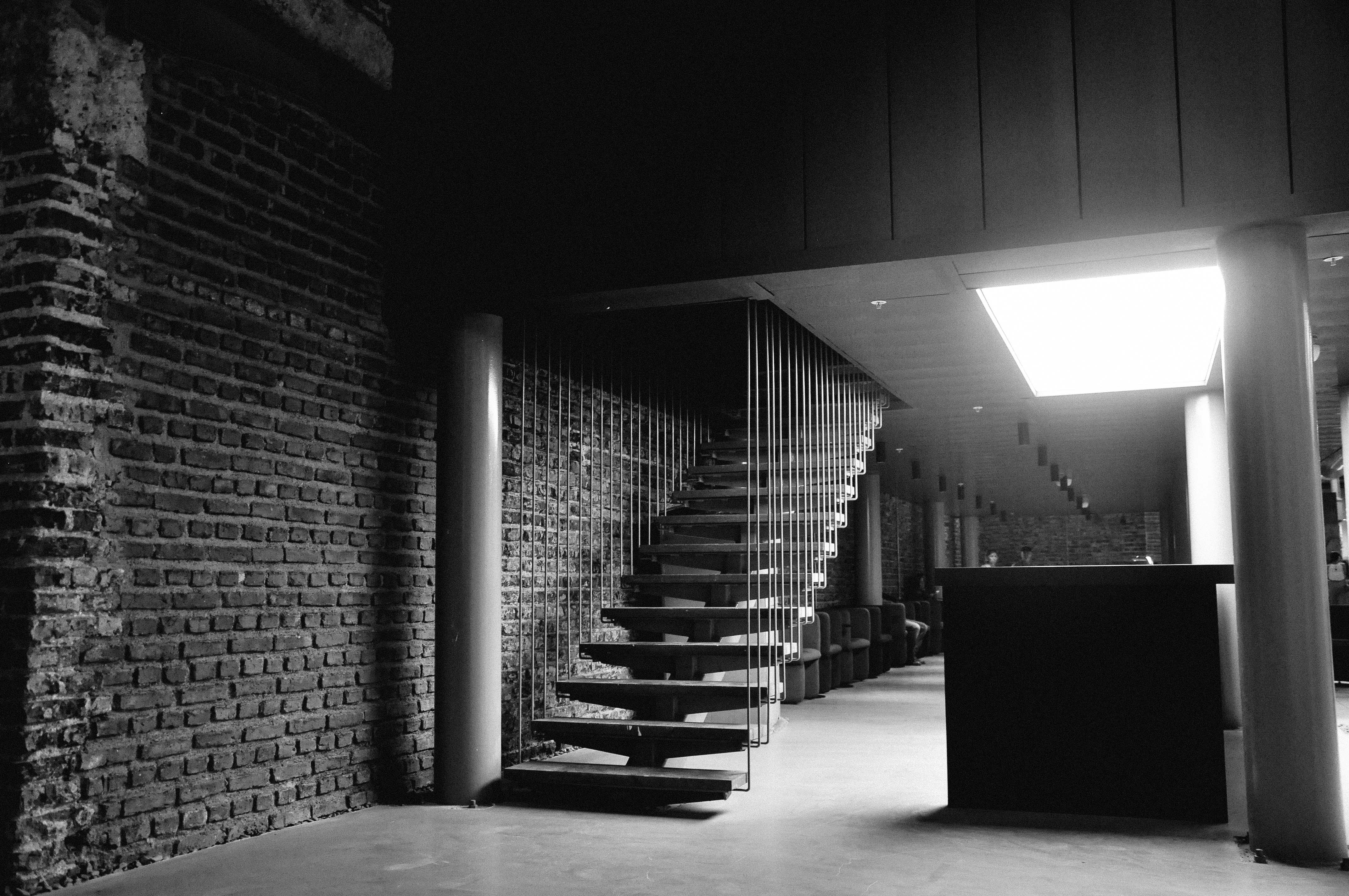 Industrial Staircase in a Quiet Loft: A Monochrome Ascent Toward Light