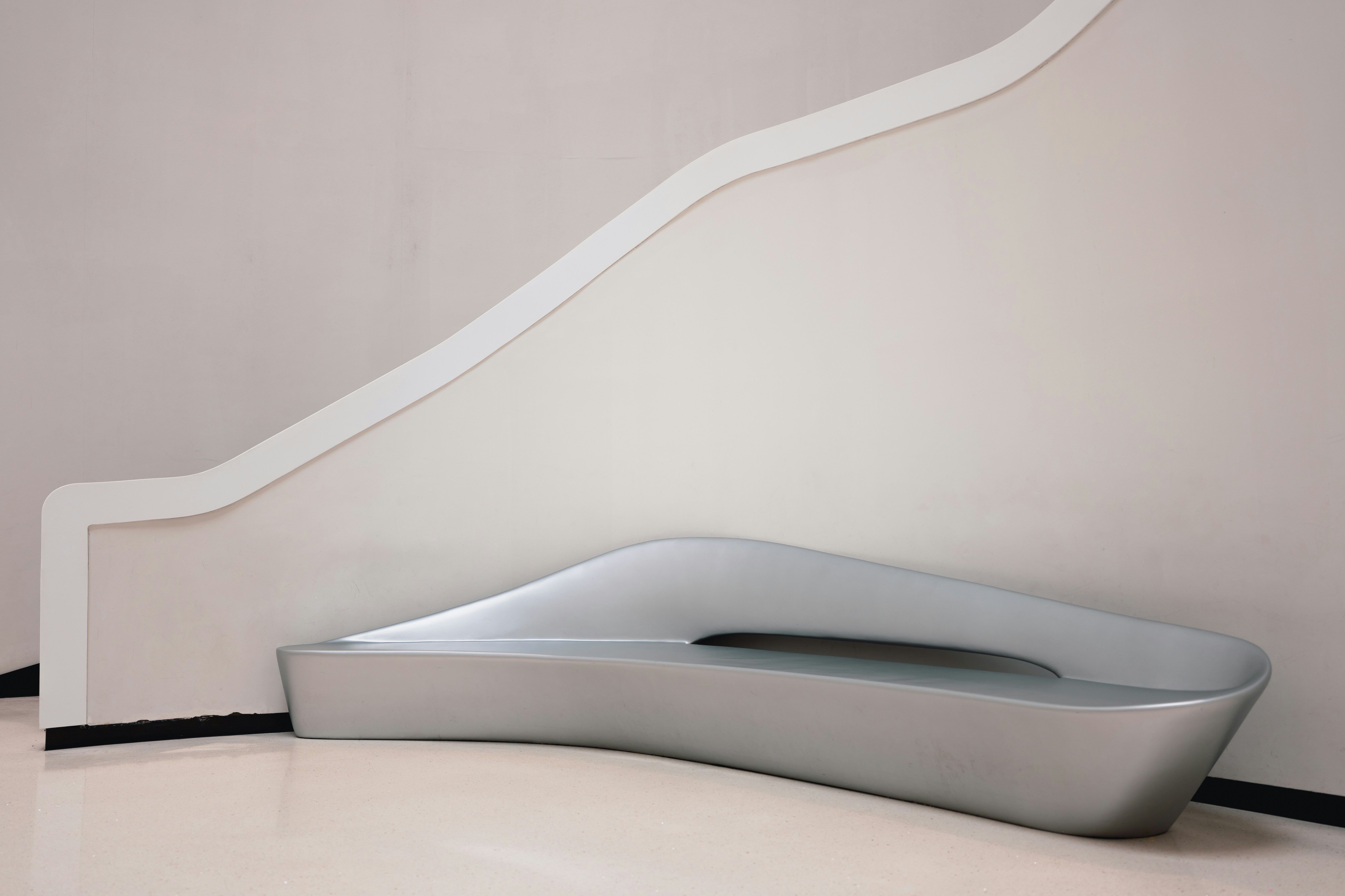 A curved white object sitting on the floor photo – Free Shanghai ...