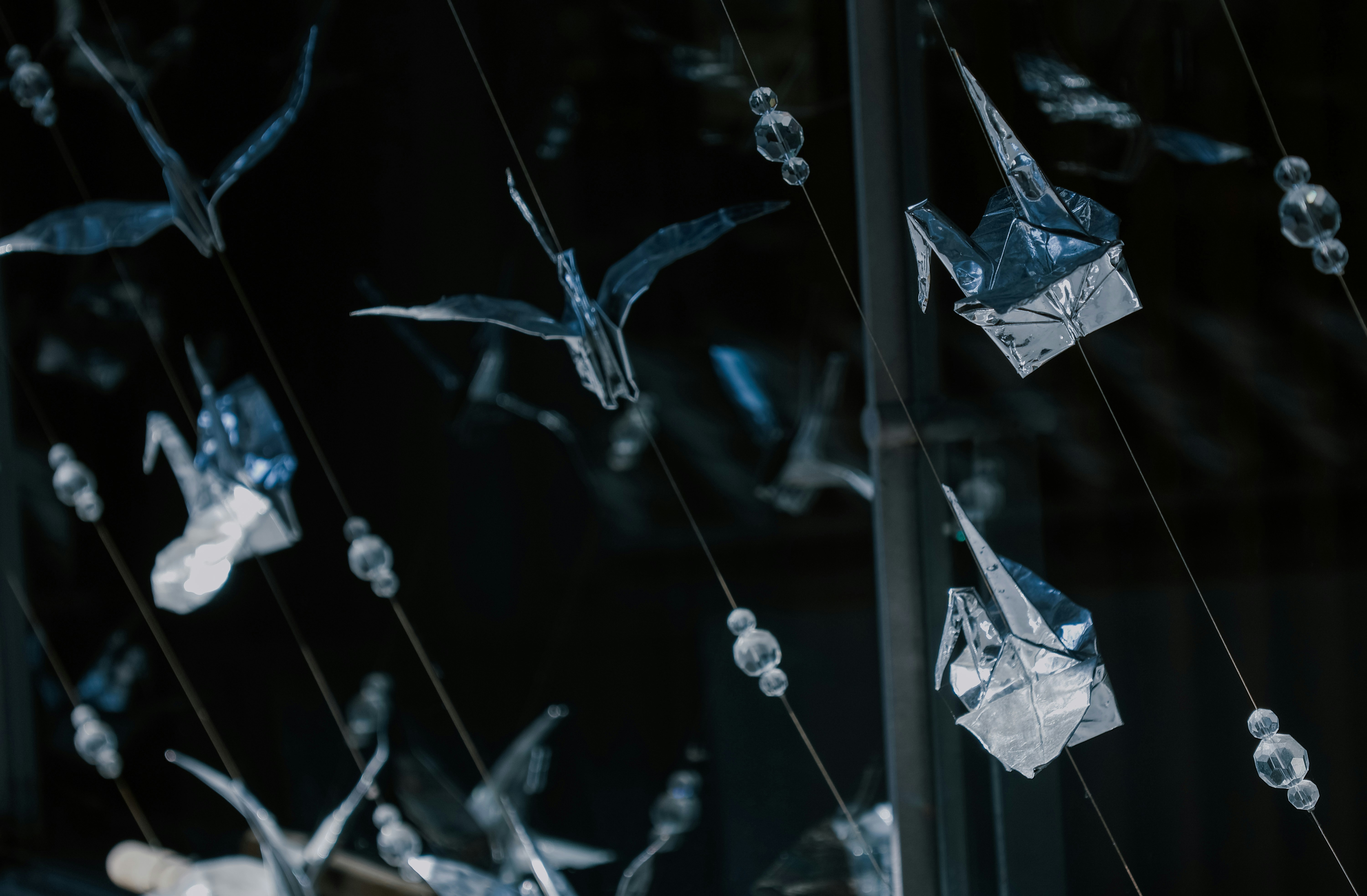 A group of origami birds hanging from strings photo – Free Japan travel ...