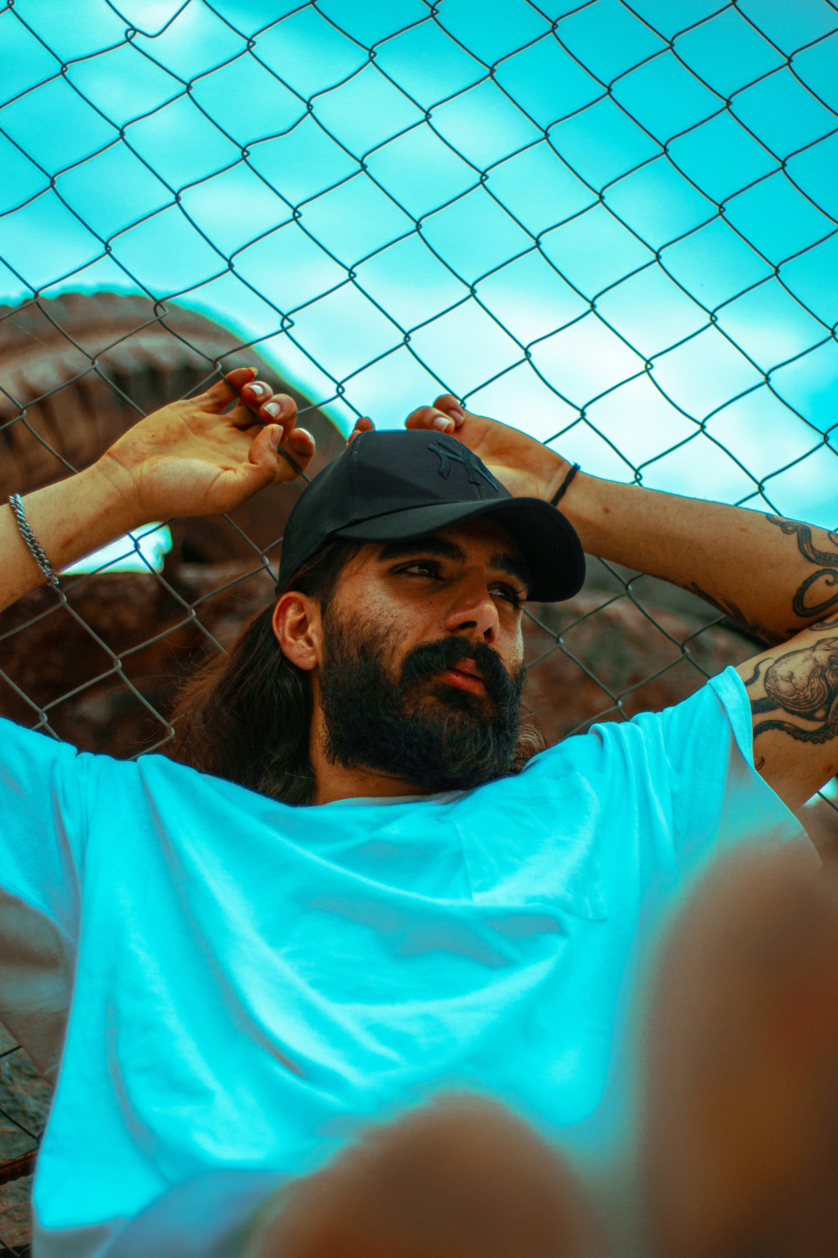 A man with a beard wearing a baseball cap photo – Free Portrait Image ...