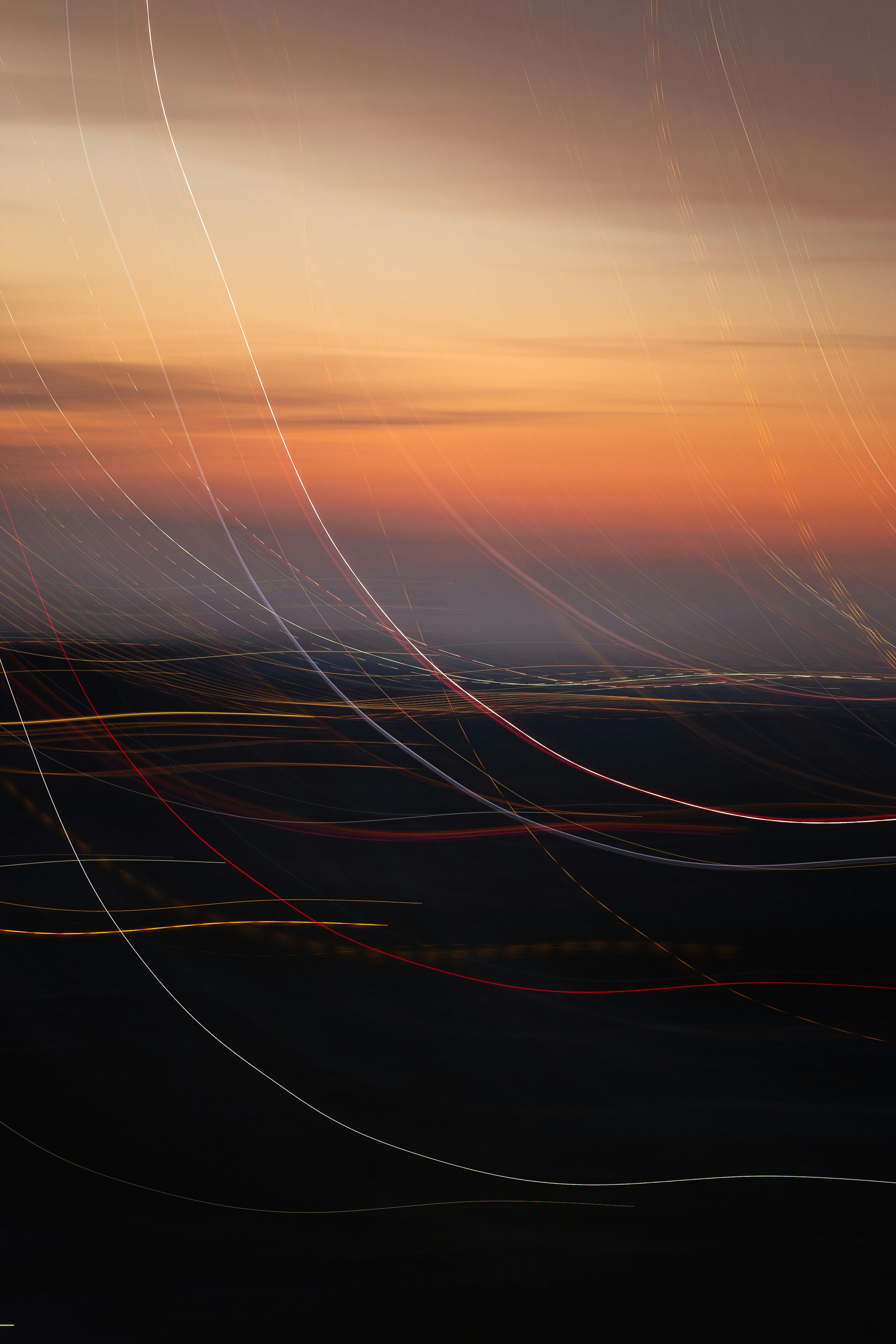 a photo of a sunset with lines in the sky
