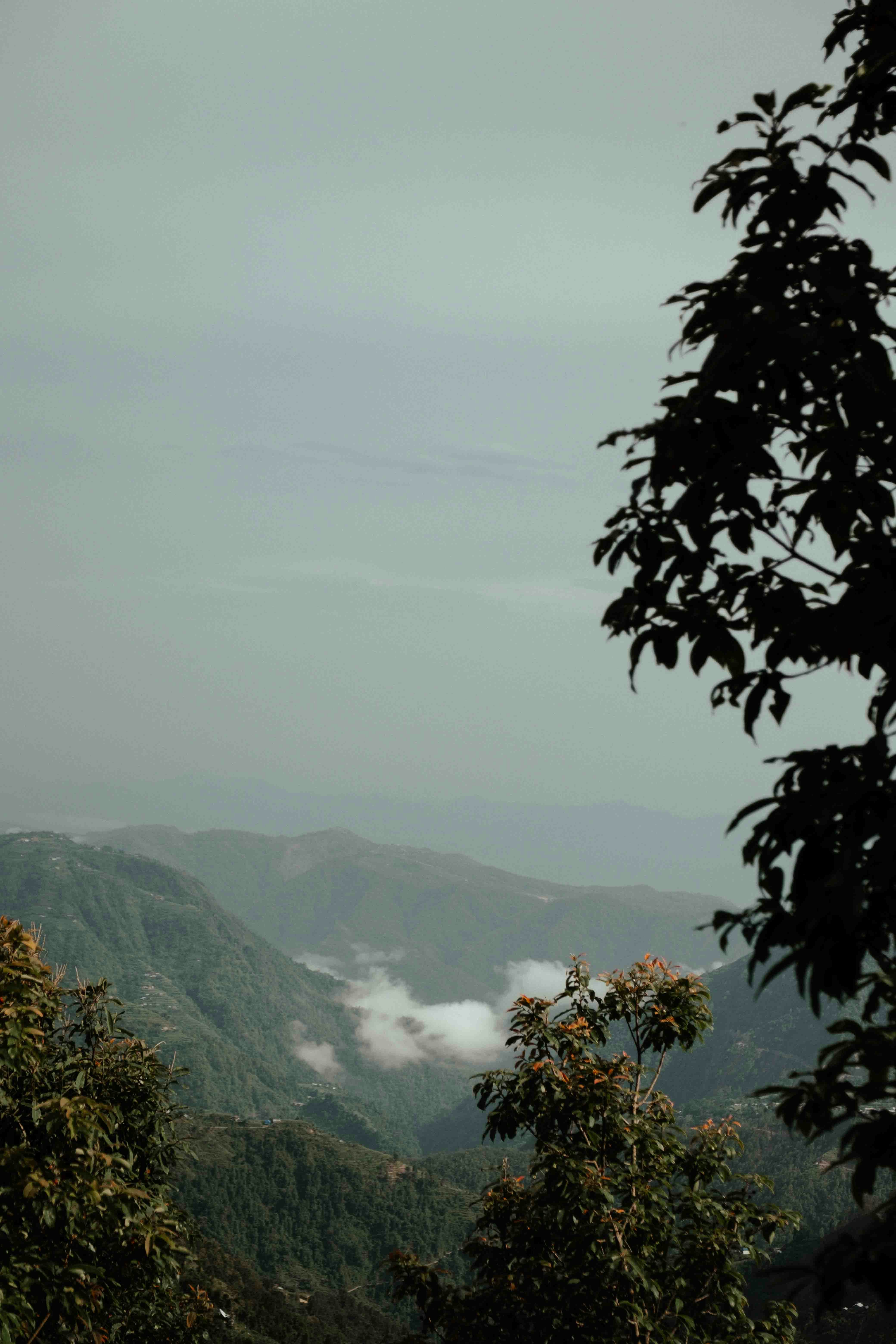 A view of a mountain range from a distance photo – Free Chandanpur ...