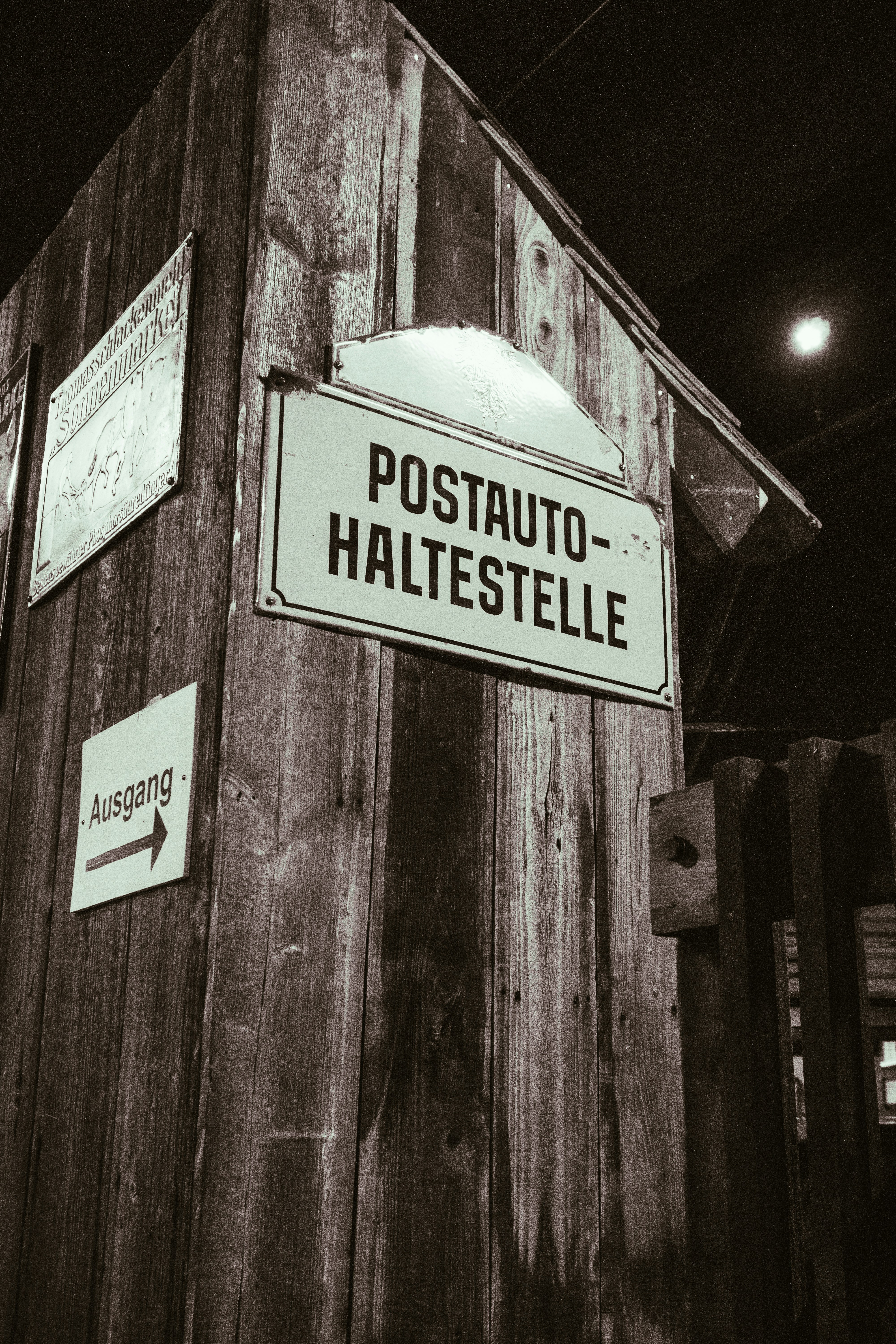 Old German Post Auto Haltestelle Signage in Dim Wood Interior