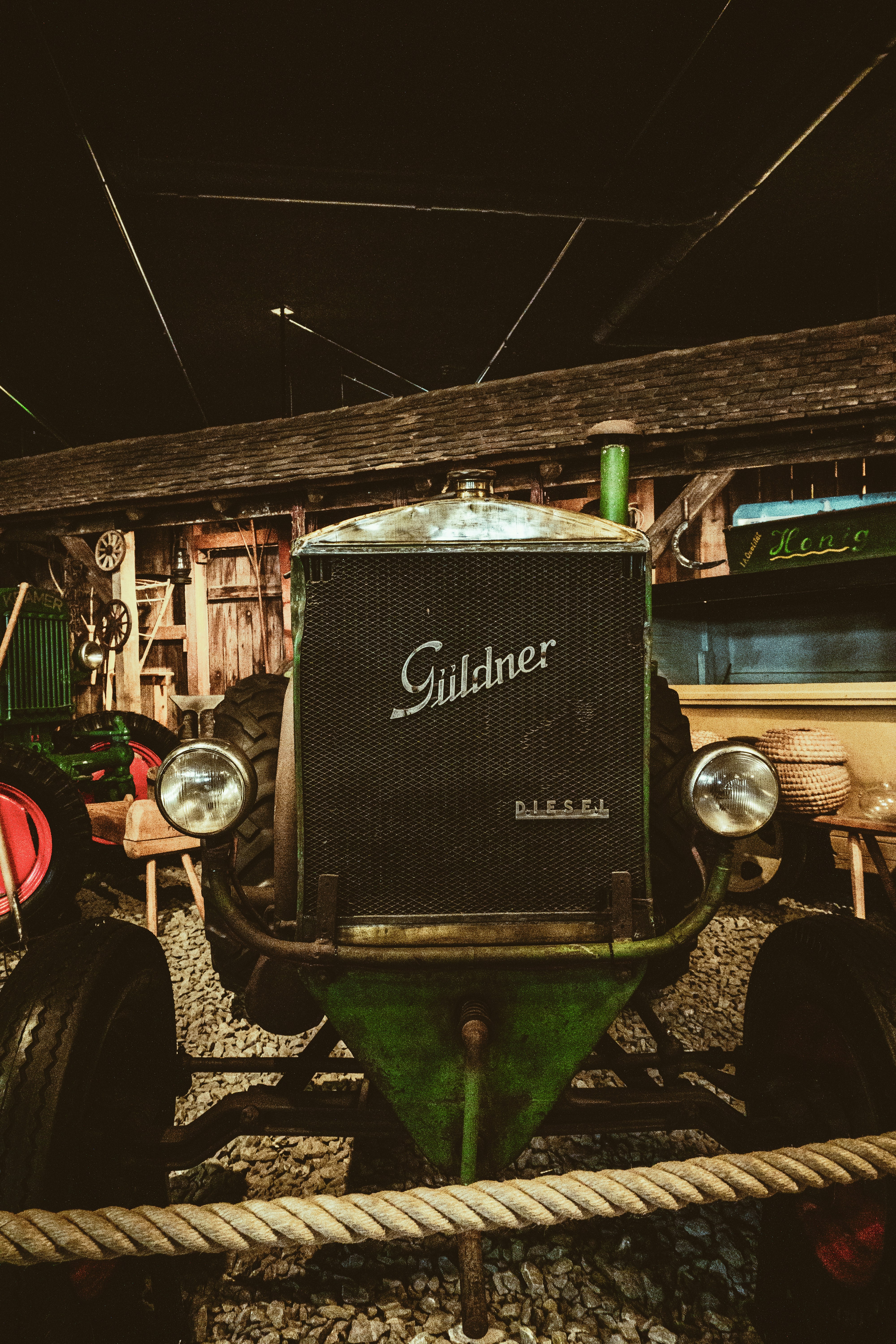 Centered Guldner Tractor in a Rustic Barn: A Timeless Rust and Steel Portrait