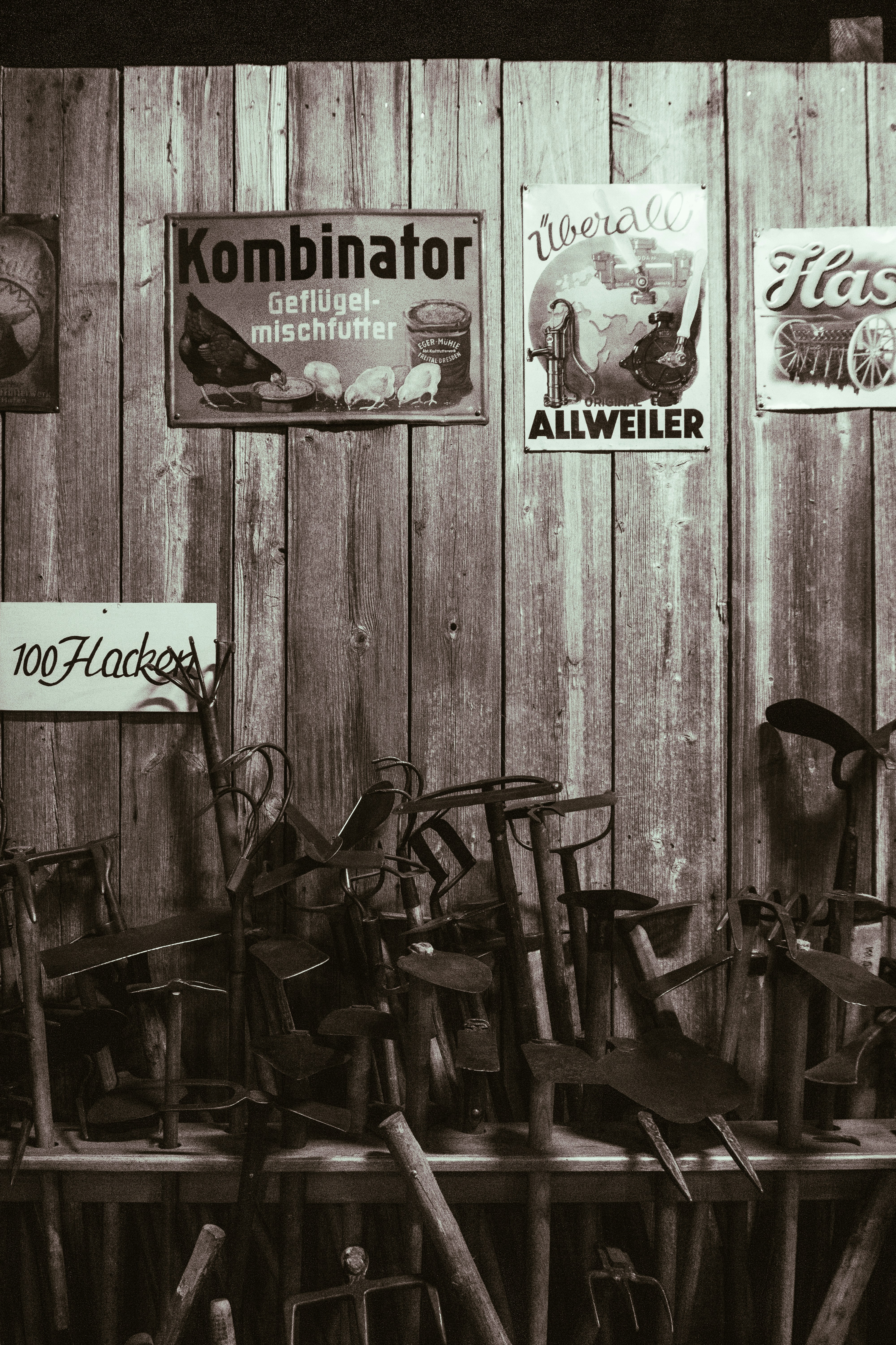 Rust and Posters on a Weathered Wooden Wall