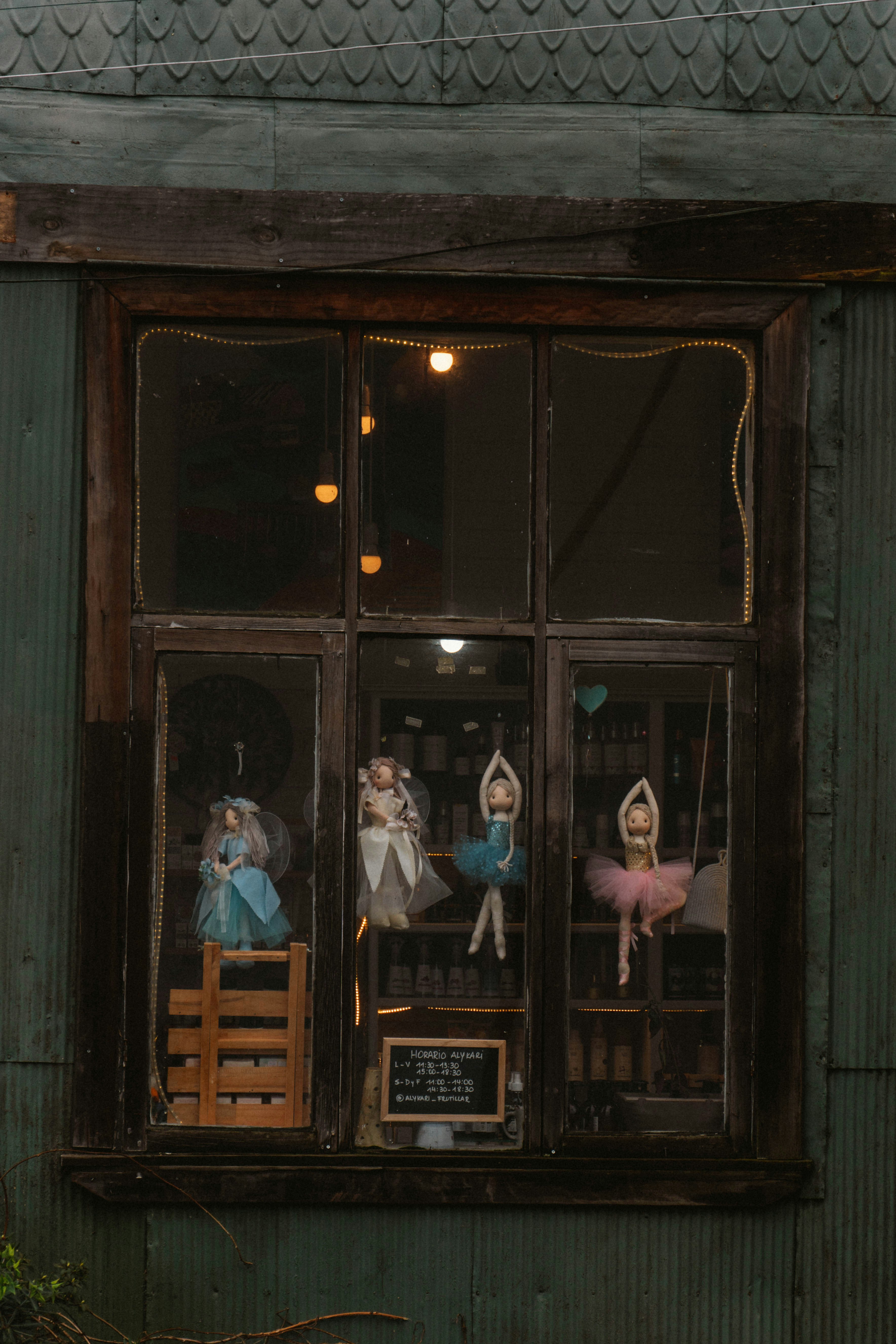 A window that has a bunch of dolls in it photo – Free Frutillar Image ...