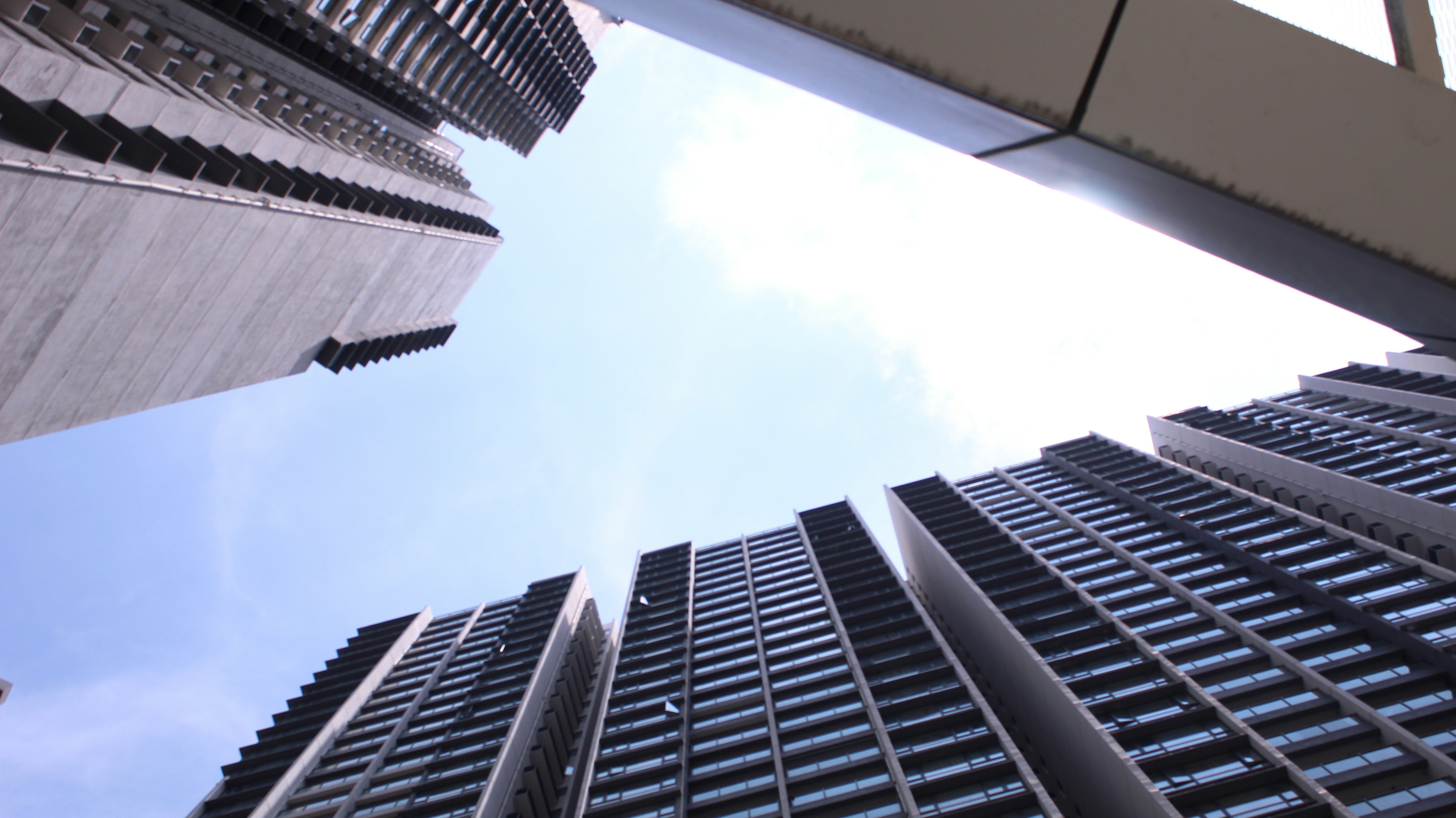 Looking up at tall buildings in a city photo – Free City background ...
