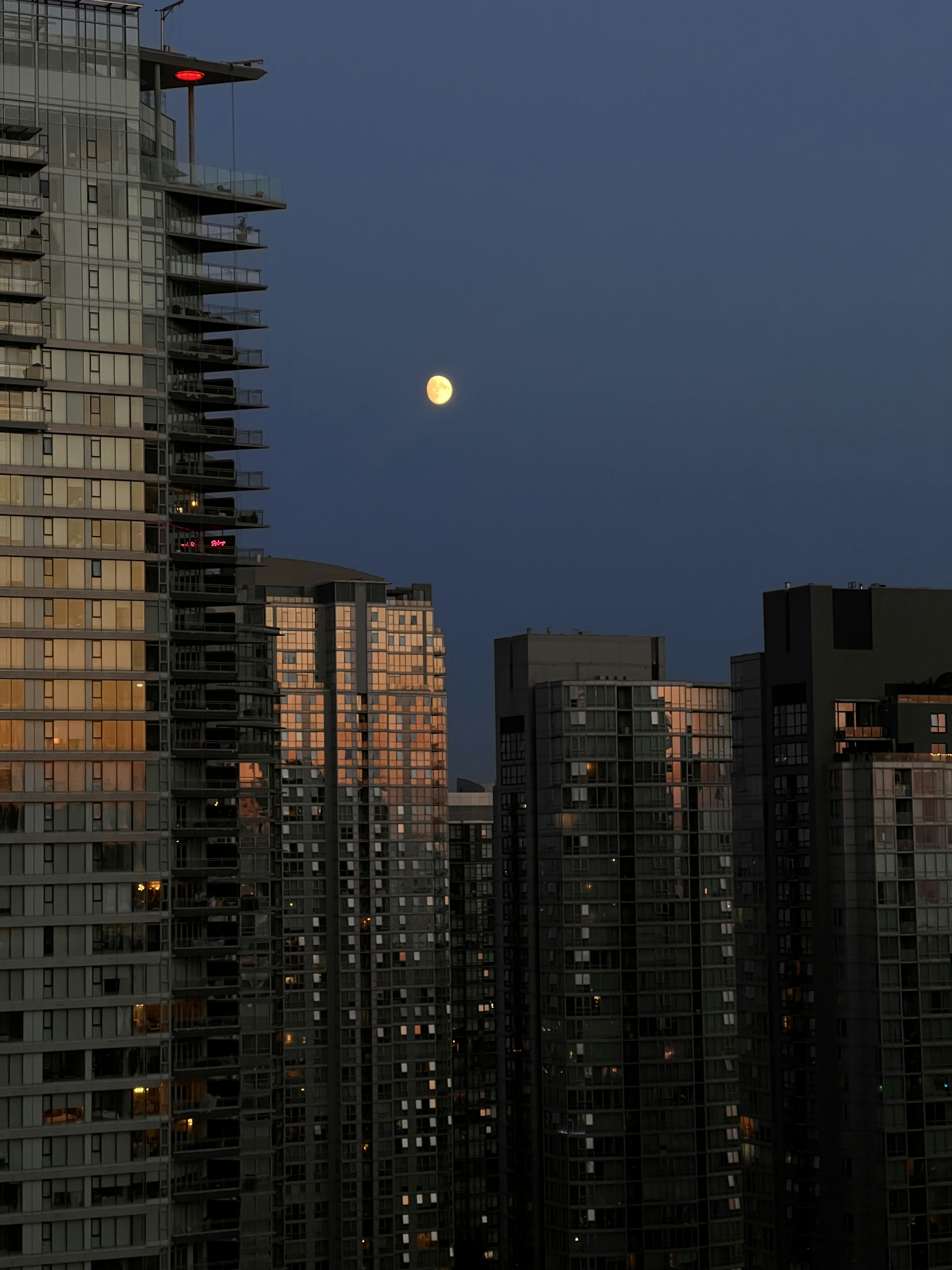 Moonrise Over Glass Towers: Dusk Cityscape in Blue Hour