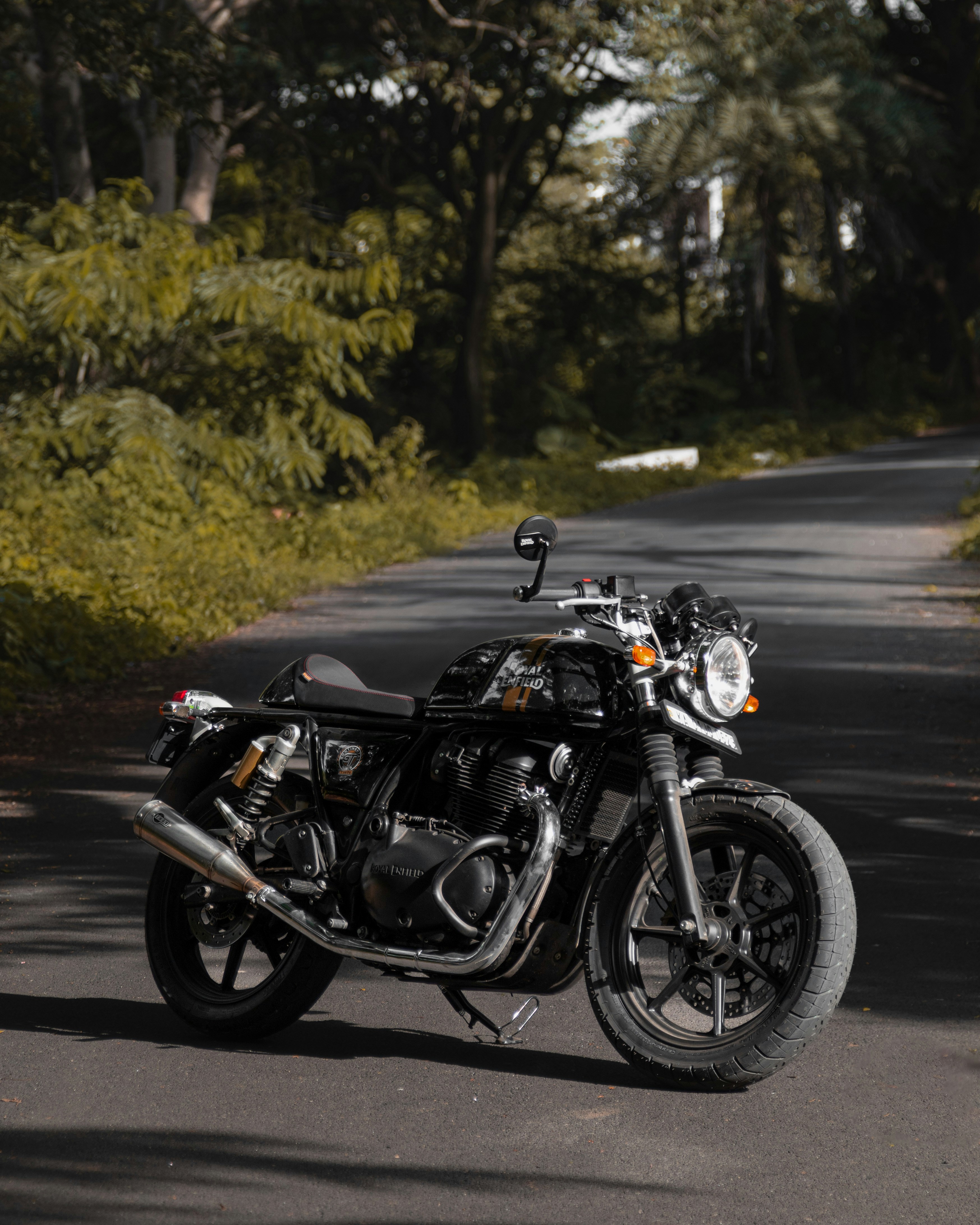 A motorcycle parked on the side of a road photo – Free Motorcycle Image ...