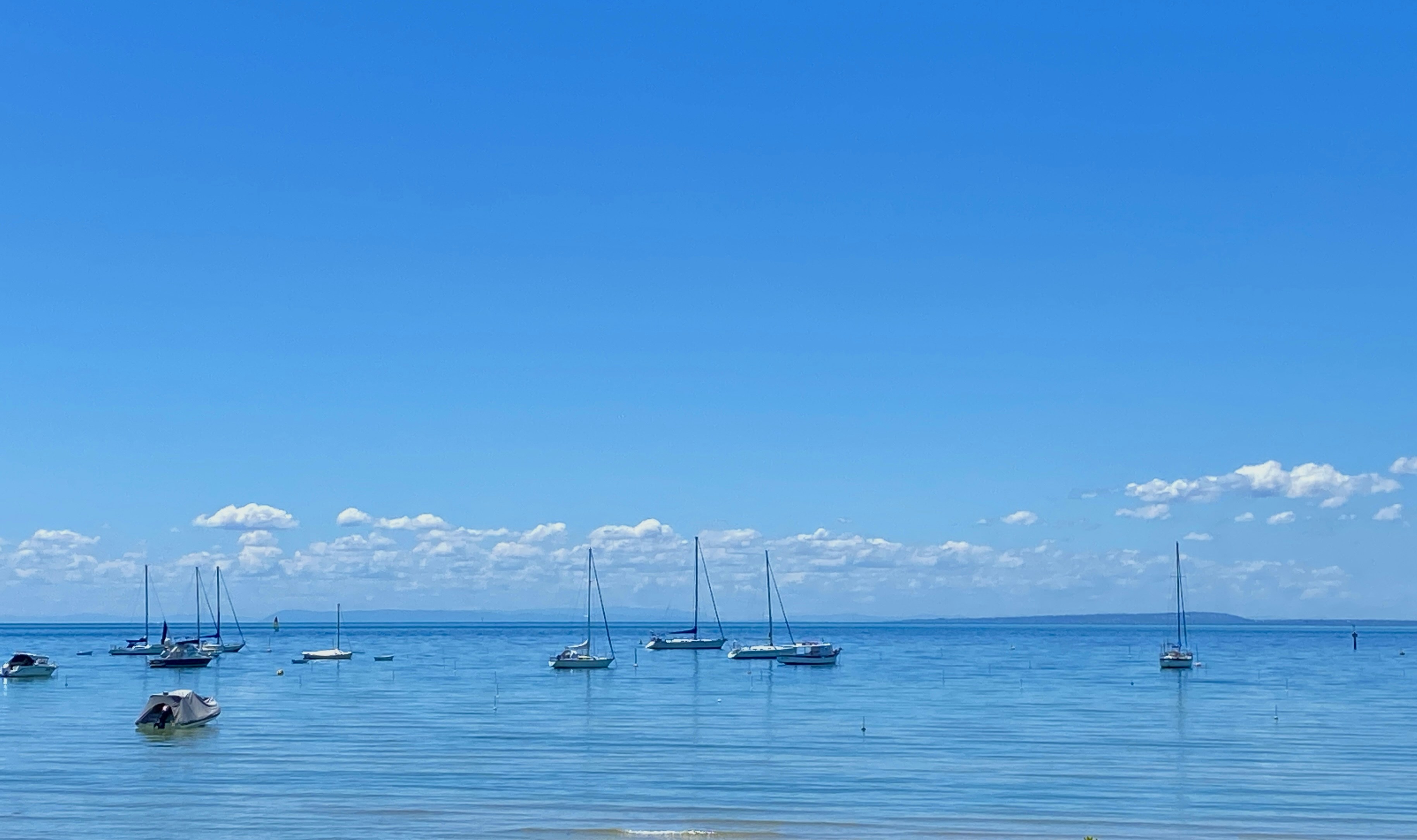 Quiet Fleet on a Glassy Cerulean Sea