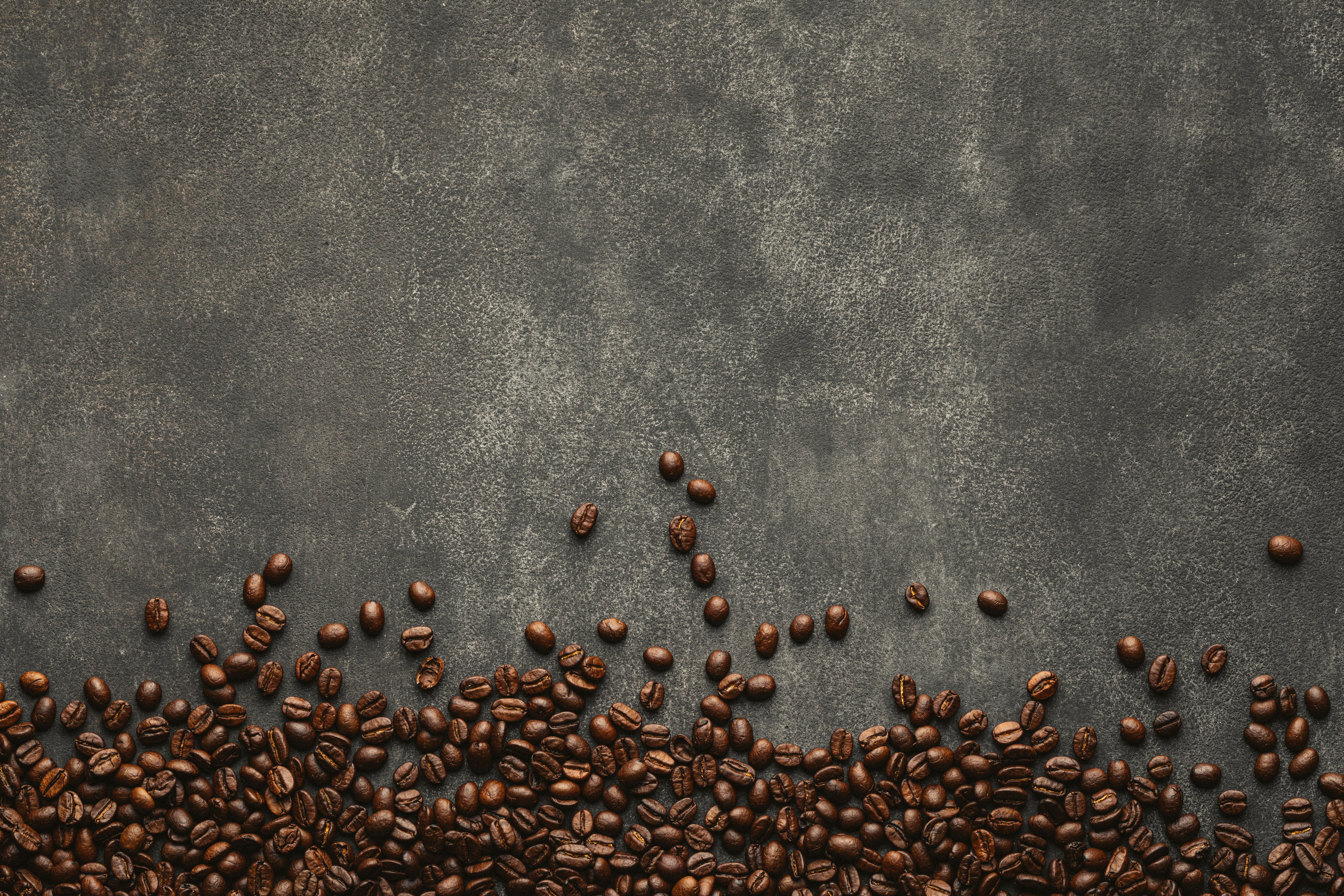 A bunch of coffee beans on a table photo – Free Background Image on ...