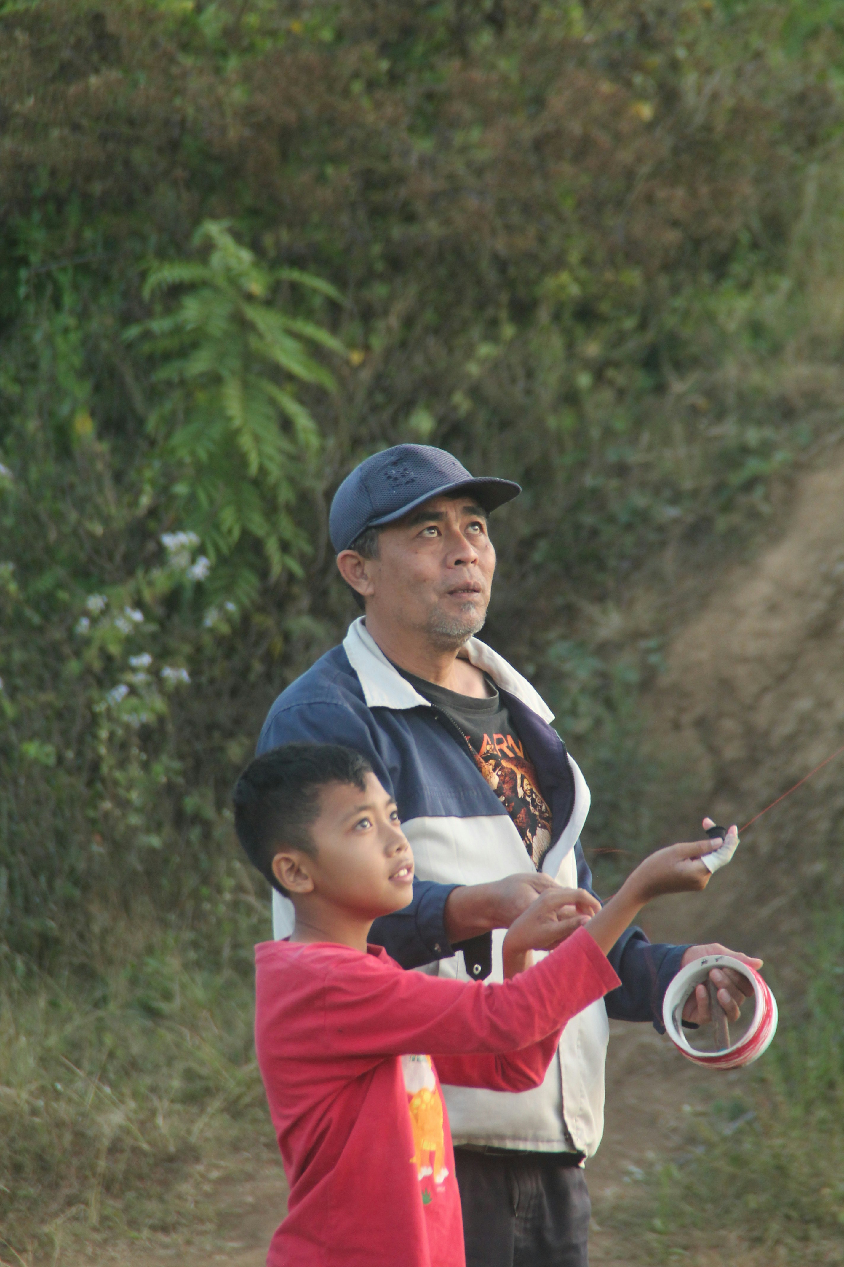 Slope-side Guidance: A Father Demonstrates the Cast to His Son