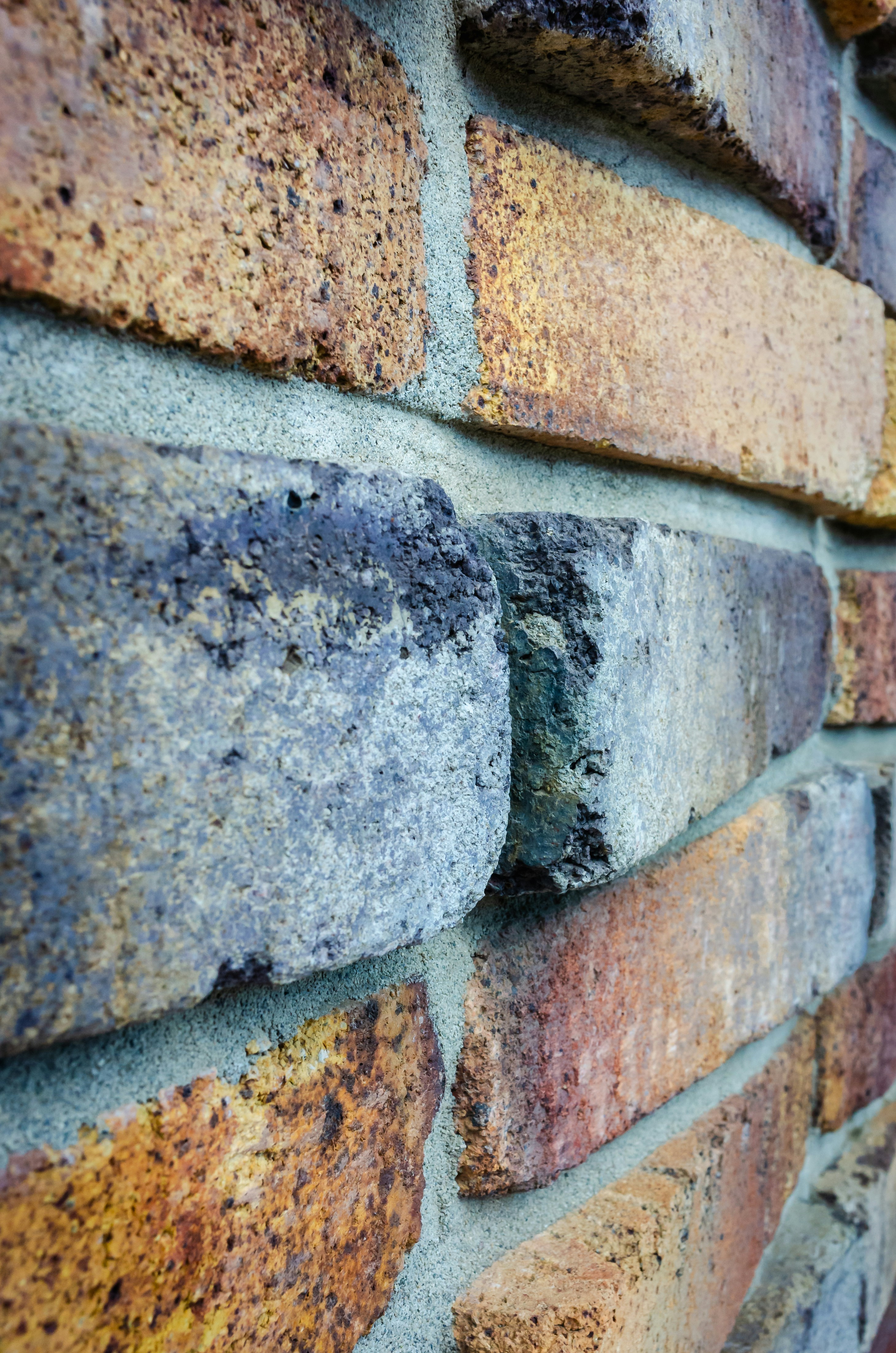 A close up of a brick wall made of bricks photo – Free Chipped brick ...