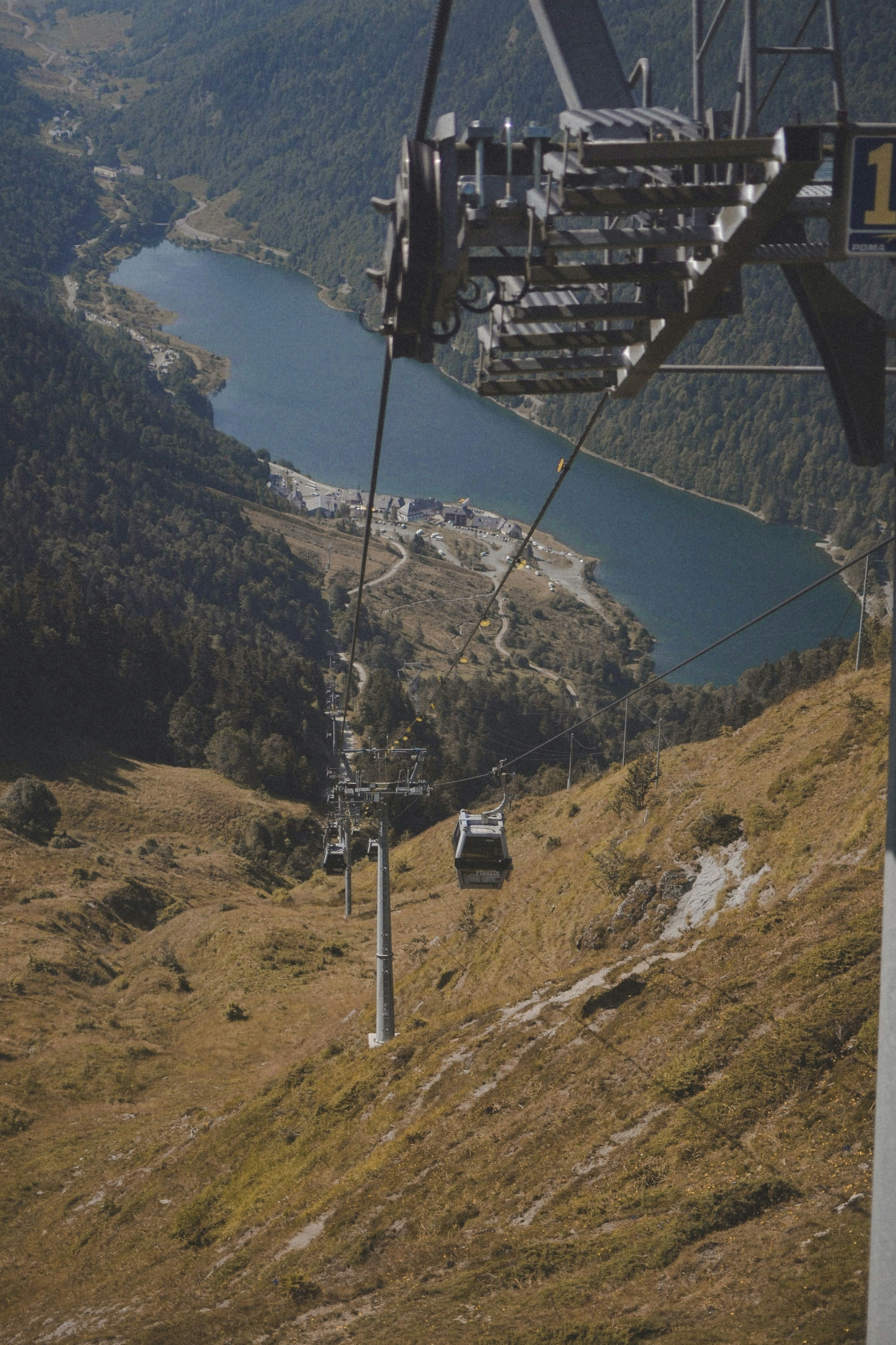 Gondola Arc Over an Alpine Valley