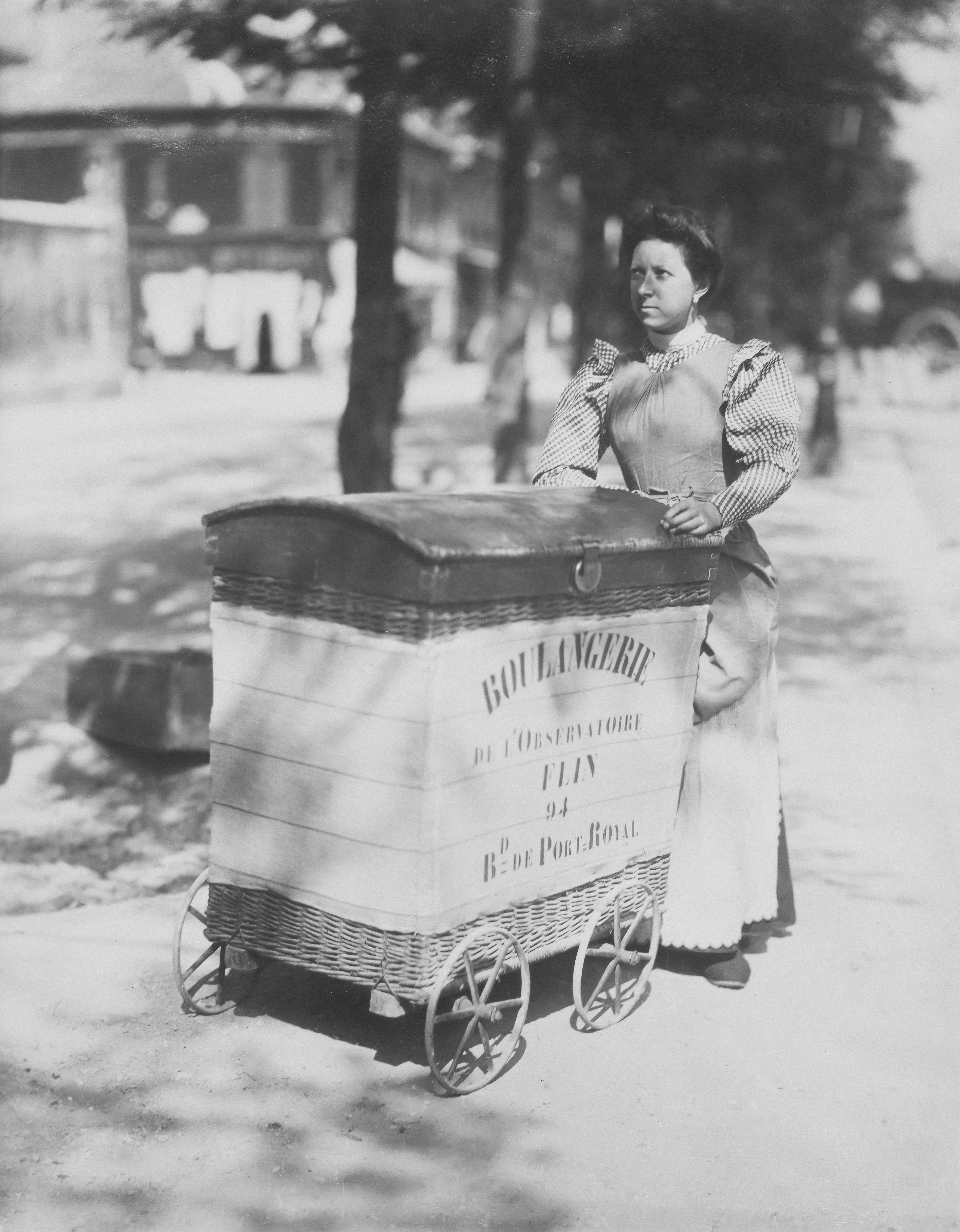 An old photo of a woman pushing a cart photo – Free Film photography ...