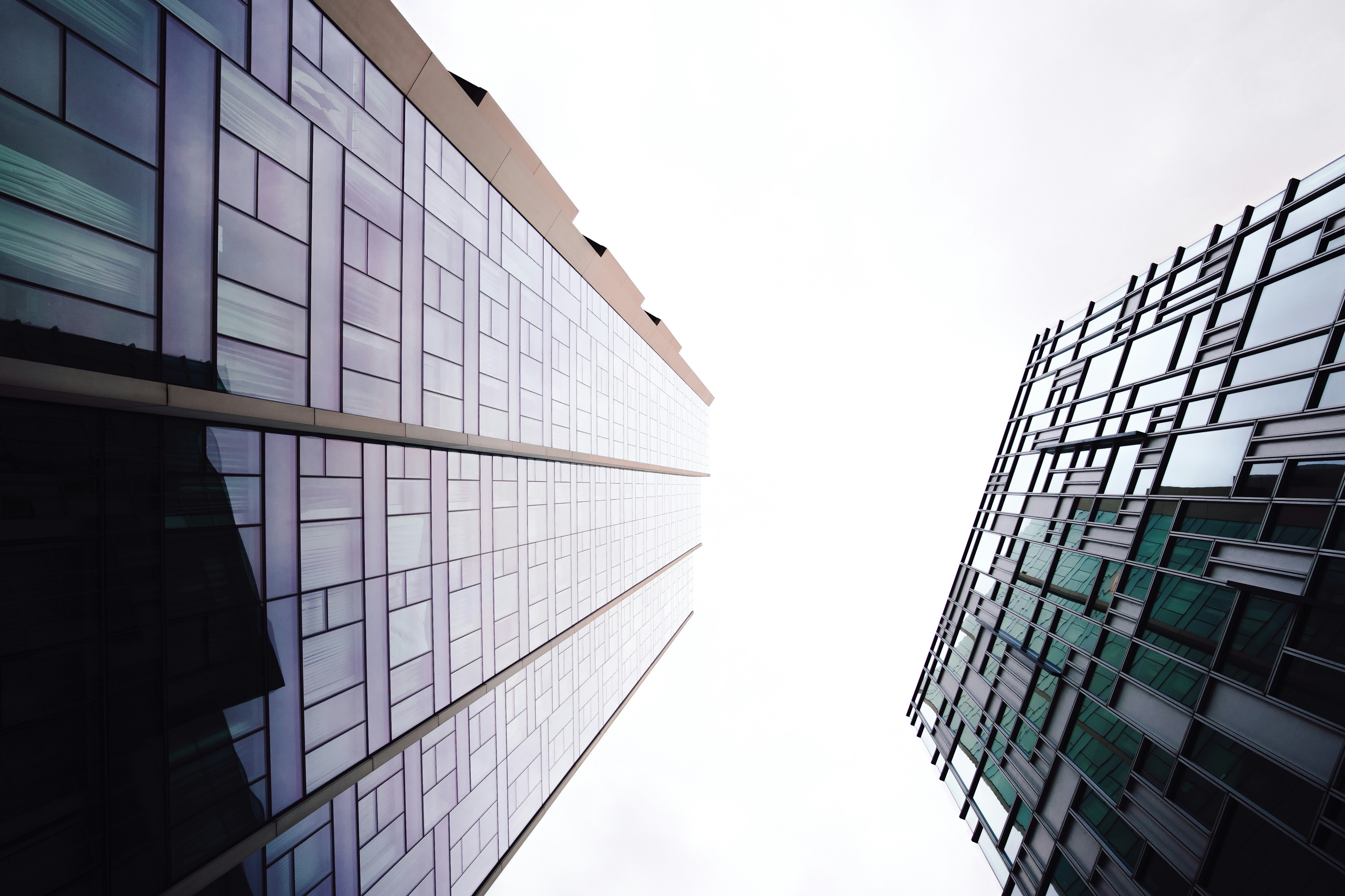 A couple of tall buildings next to each other photo – Free London Image ...