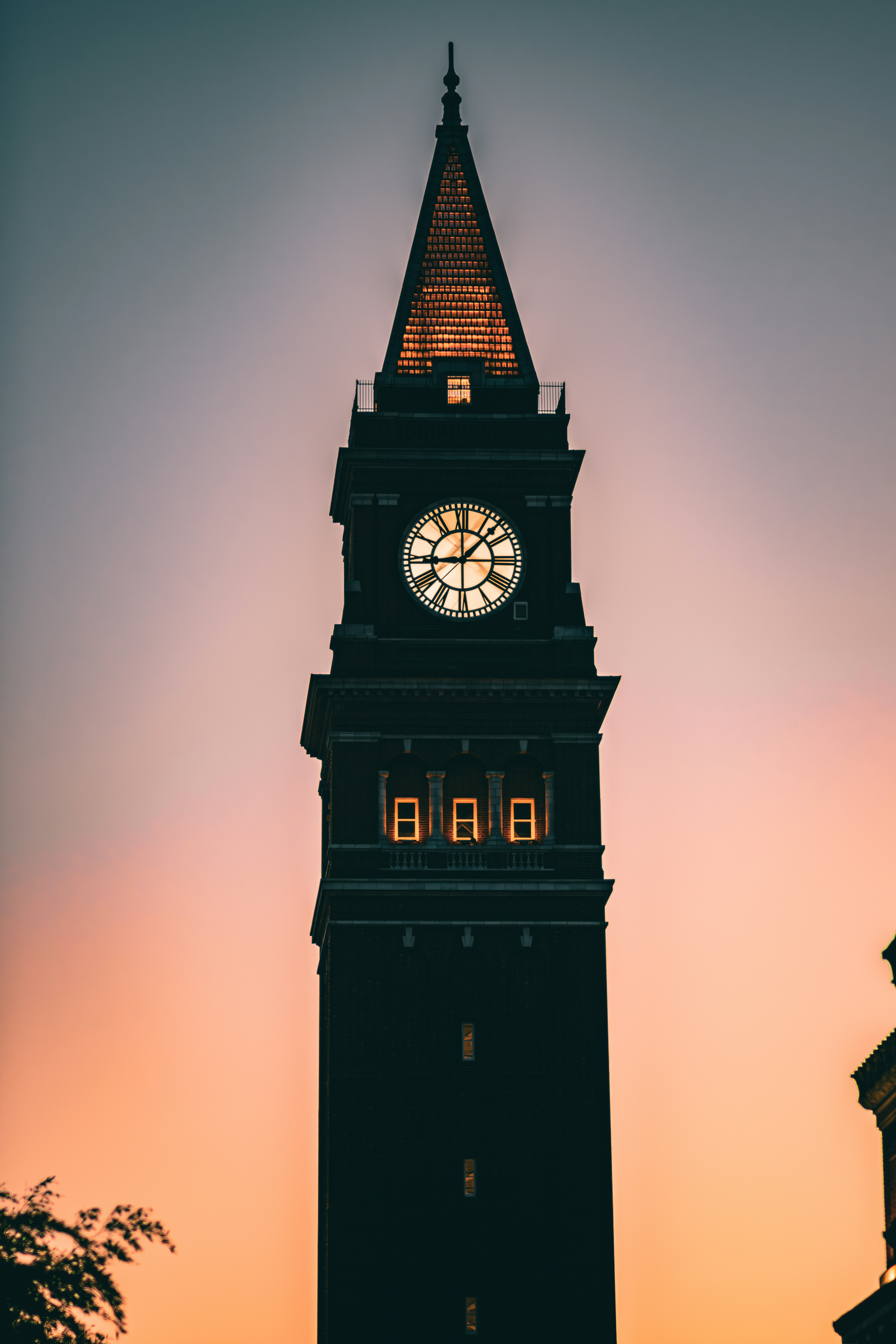 A tall clock tower with a clock on each of it's sides photo – Free ...
