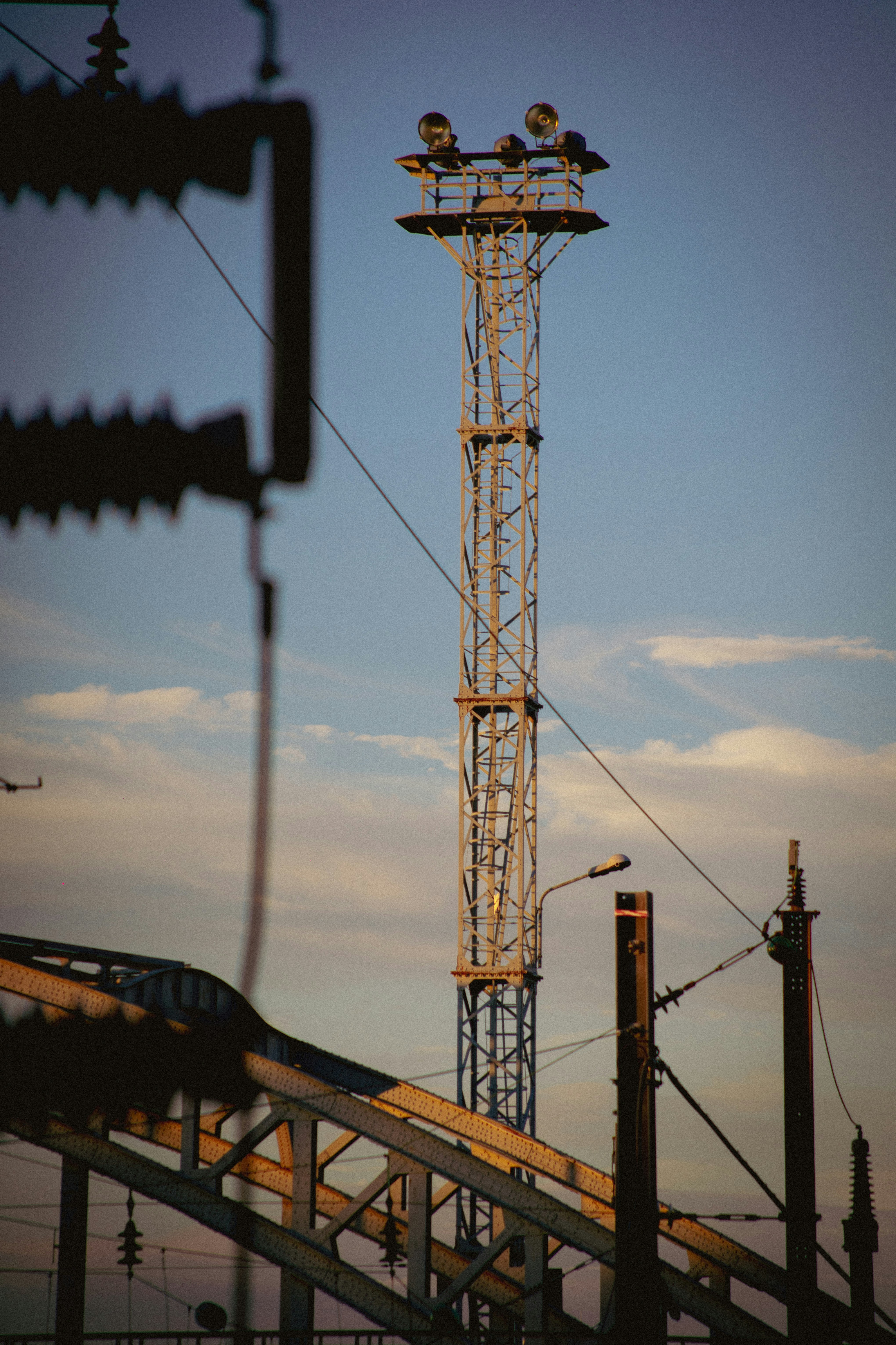 A tall tower sitting next to a train track photo – Free Canon 6d mark ...