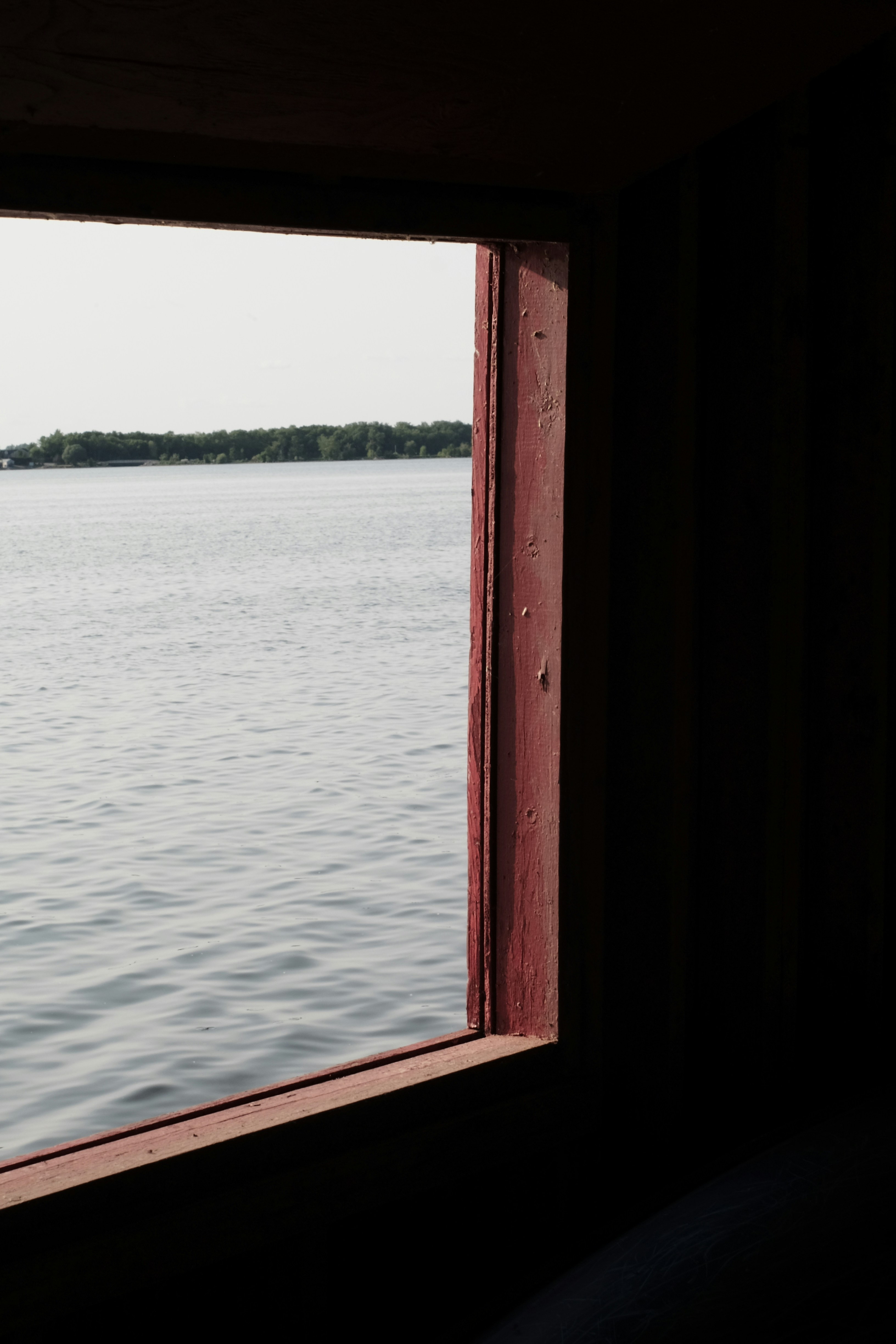 Crimson Frame, Quiet Lake: Light Through a Window