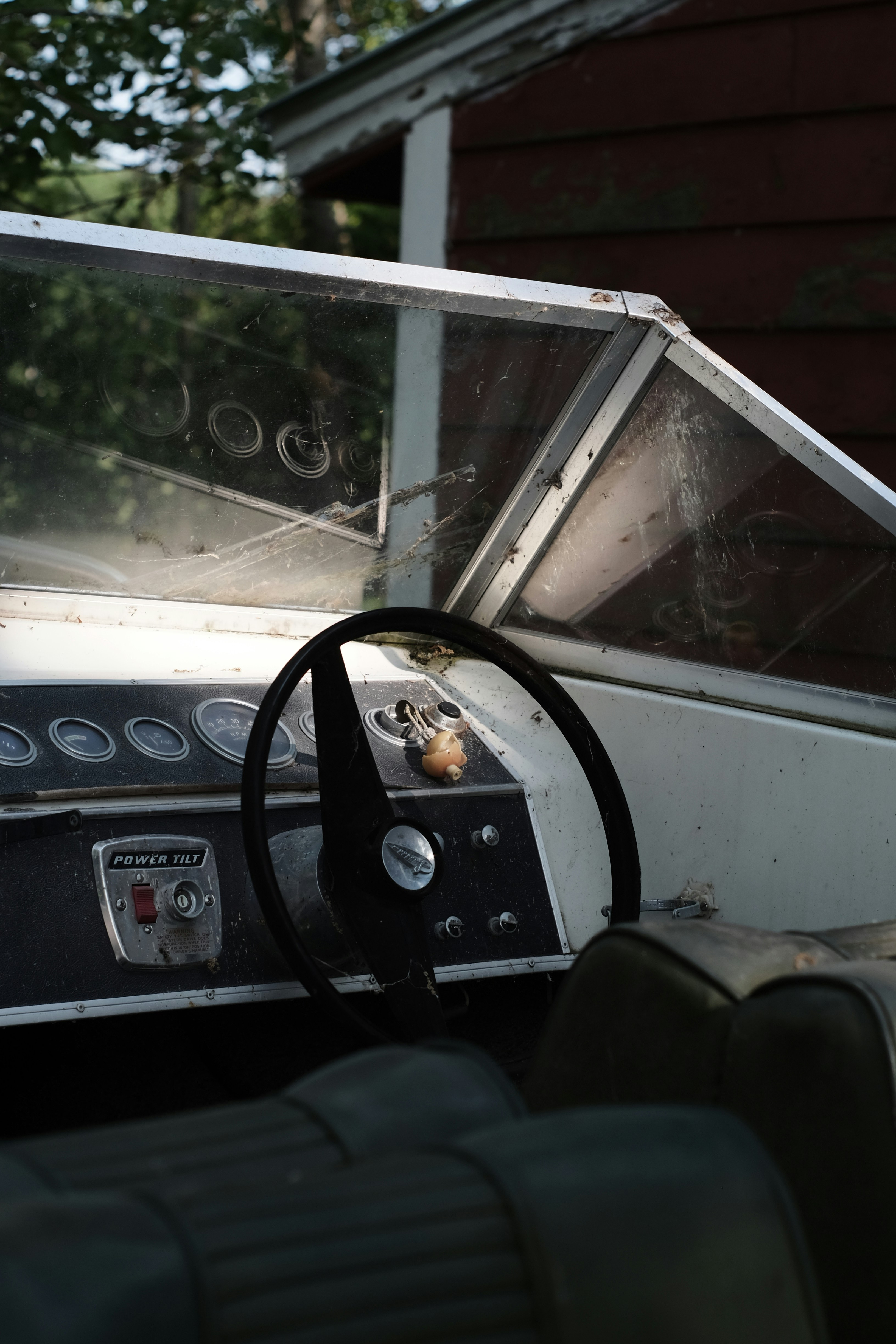 The Quiet Helm: A Weathered Boat Cockpit Preserving Nautical Memory