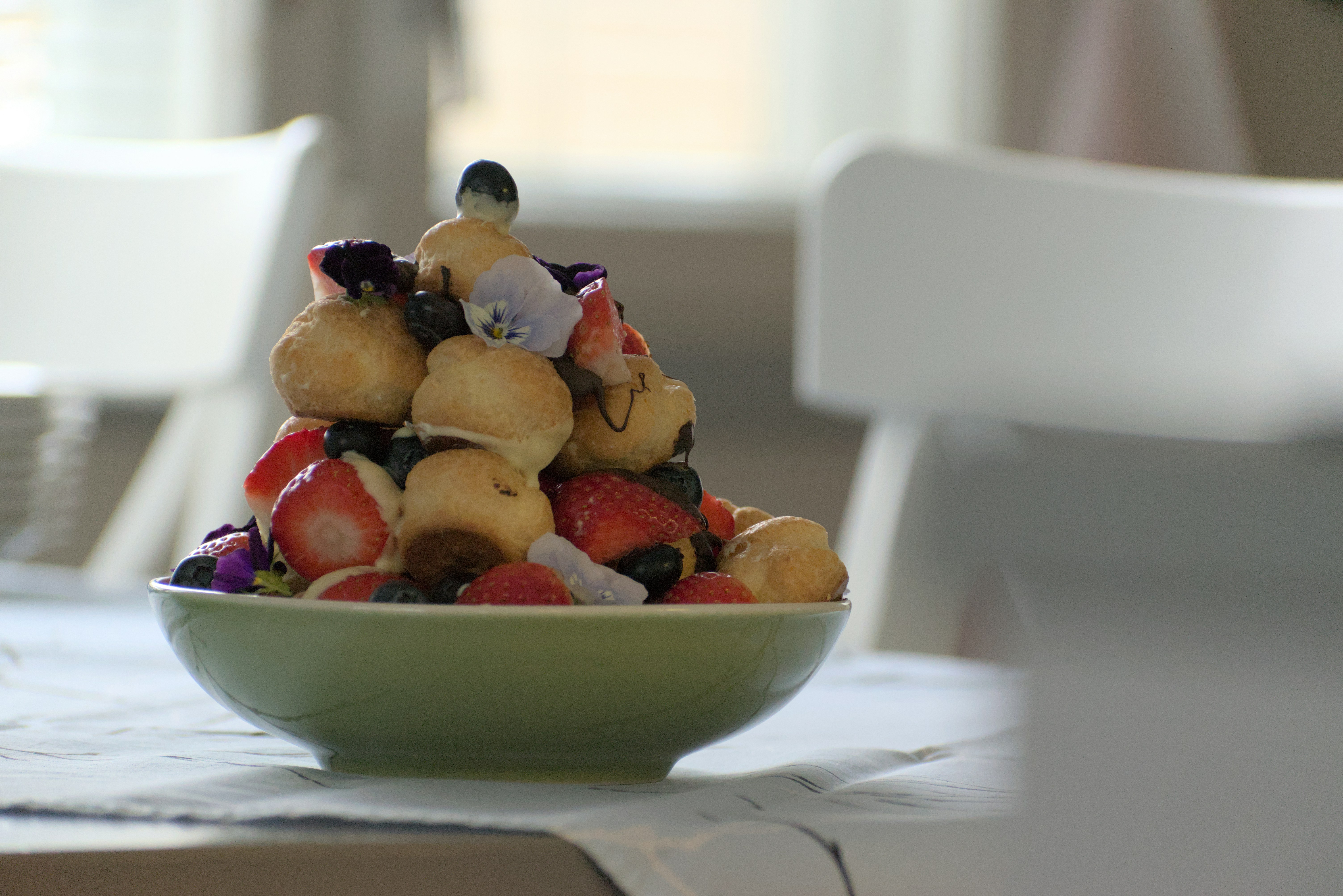 A bowl filled with fruit sitting on top of a table photo – Free Flowers ...