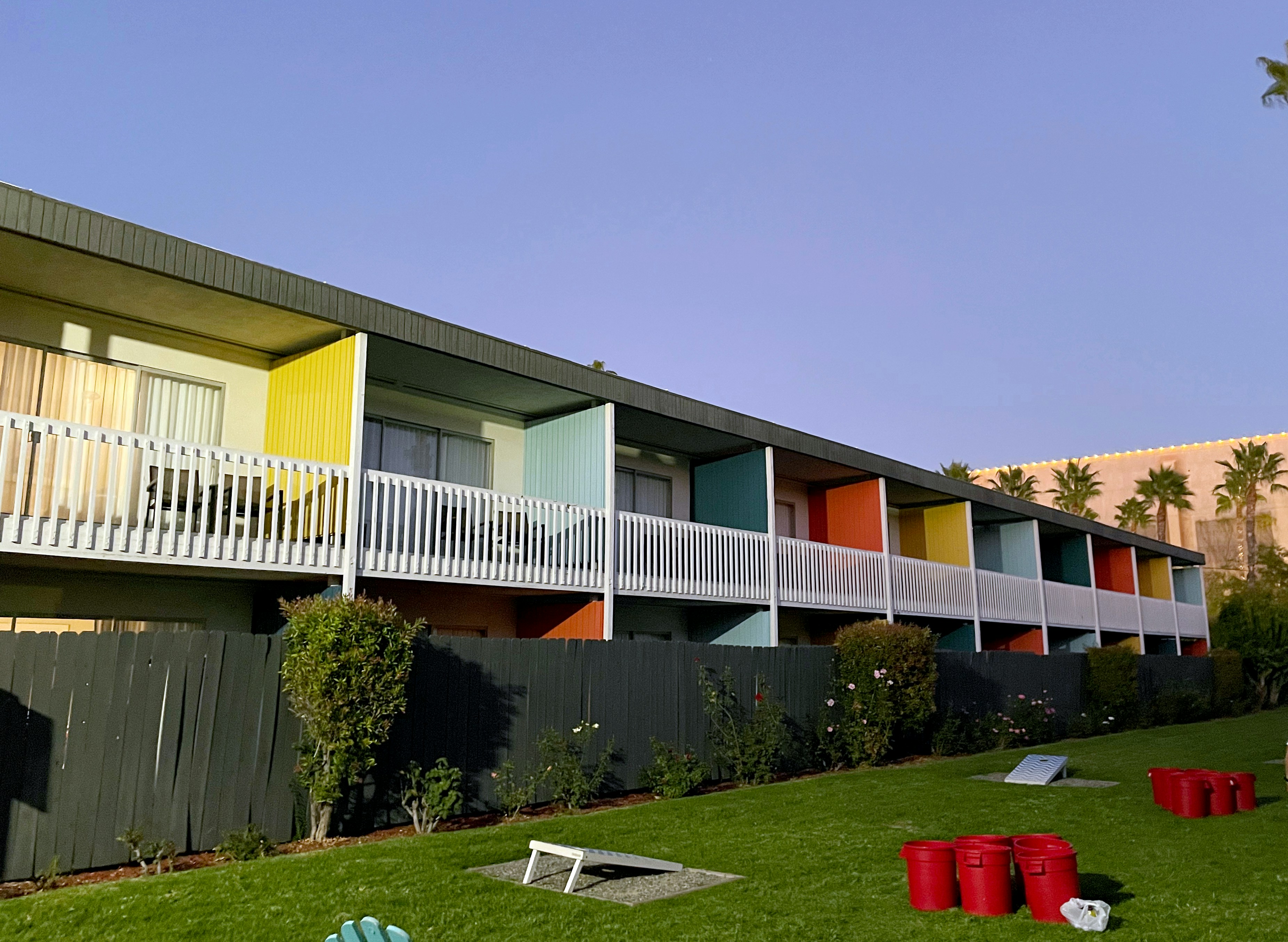 A row of multi - colored apartment buildings on a sunny day photo ...