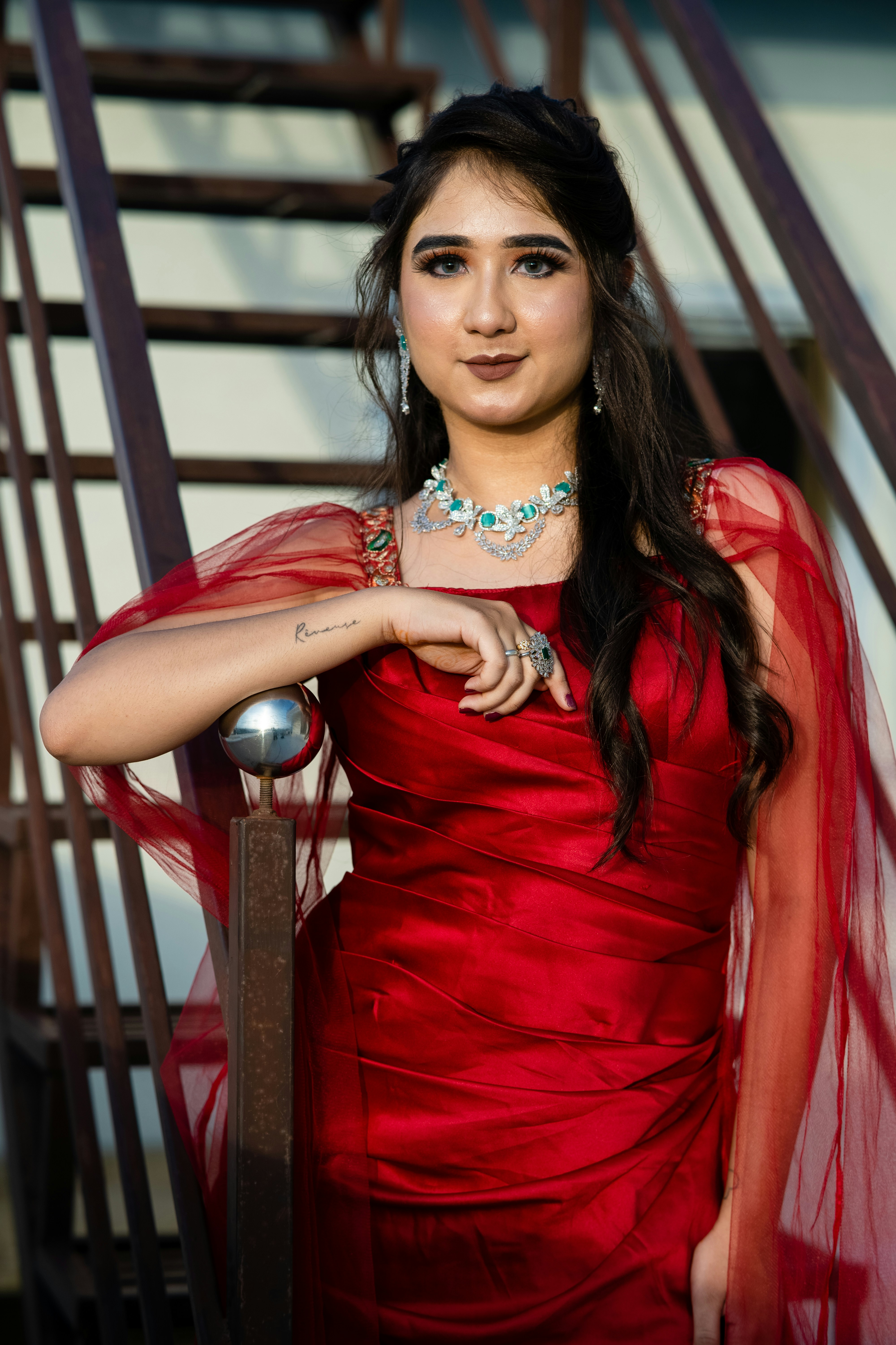 A woman in a red dress posing for a picture photo – Free Fashion Image ...