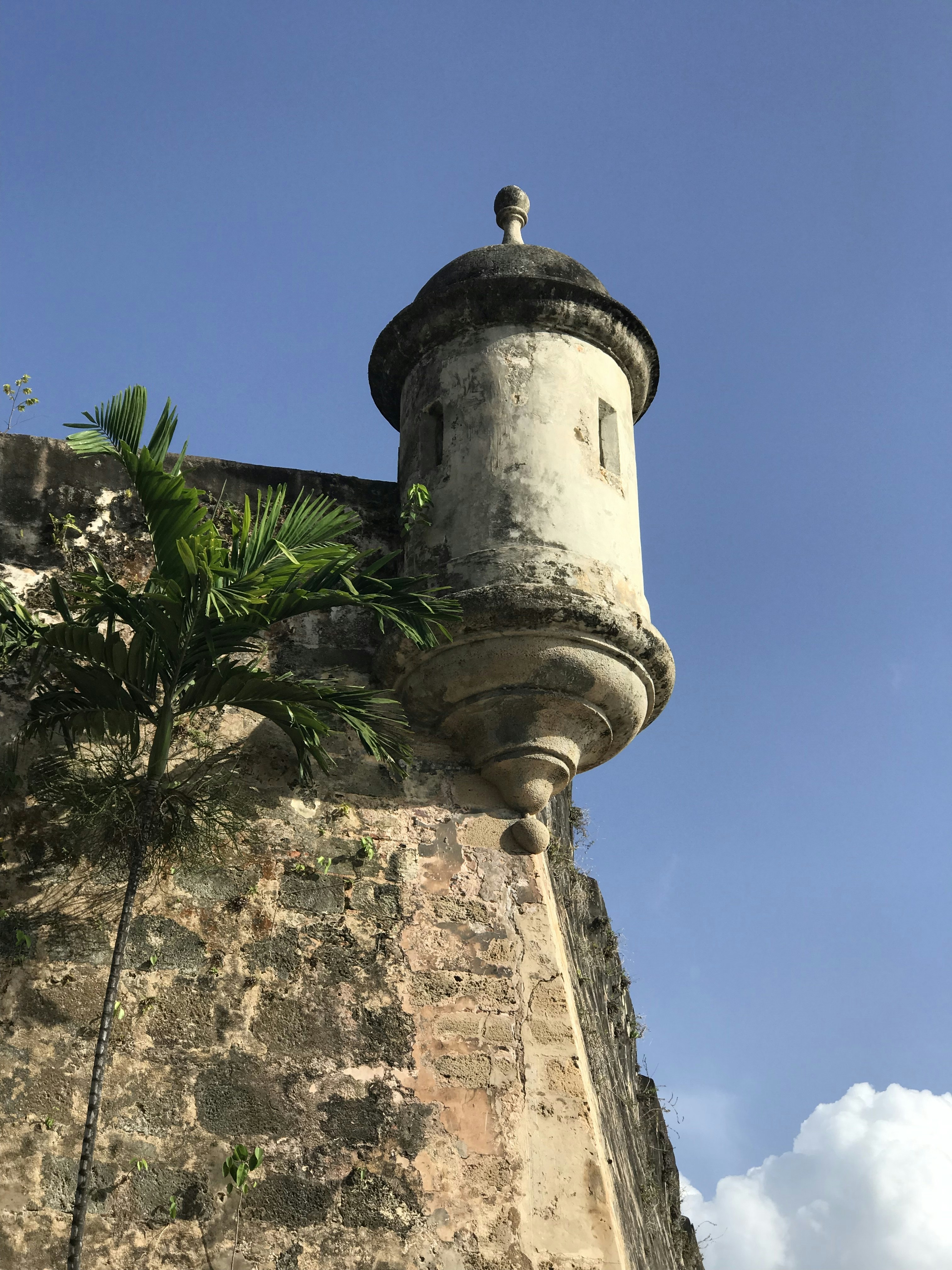A tall tower with a clock on the top of it photo – Free Puerto rico ...